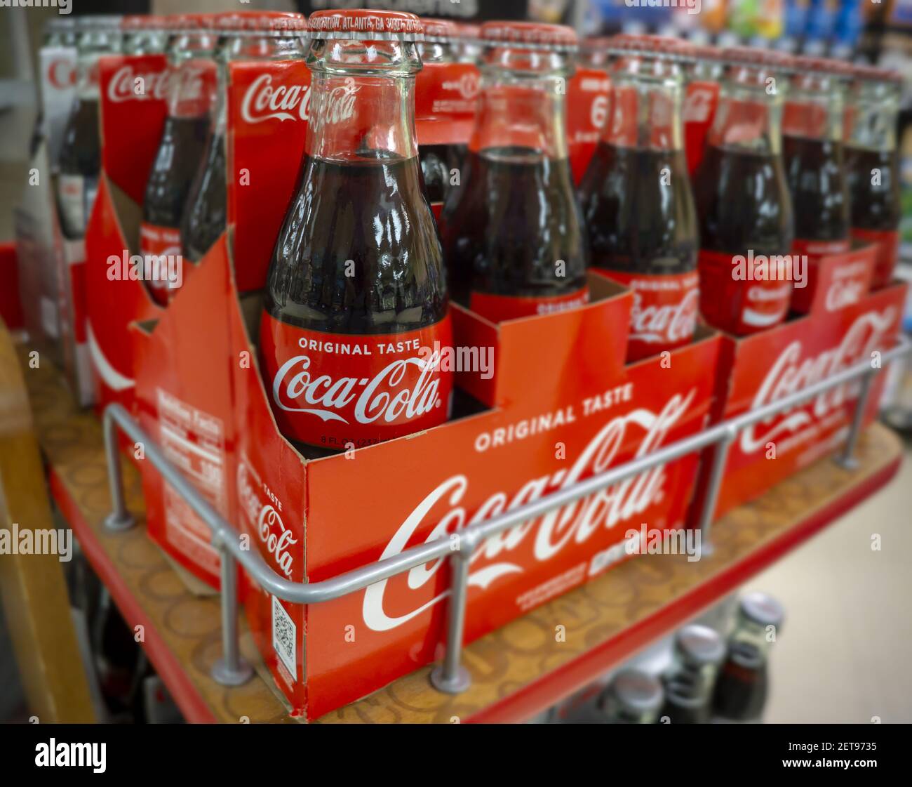Mini-bottles in six-packs of Coca-Cola in a supermarket in New York on ...