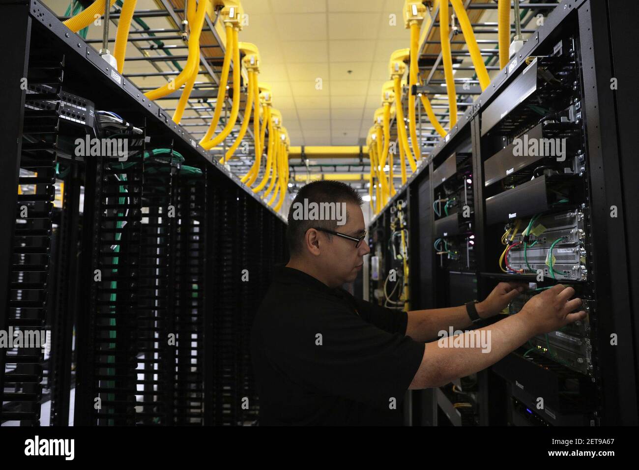 Rene Martinez, a data center tech operations technician, helps deliver ...