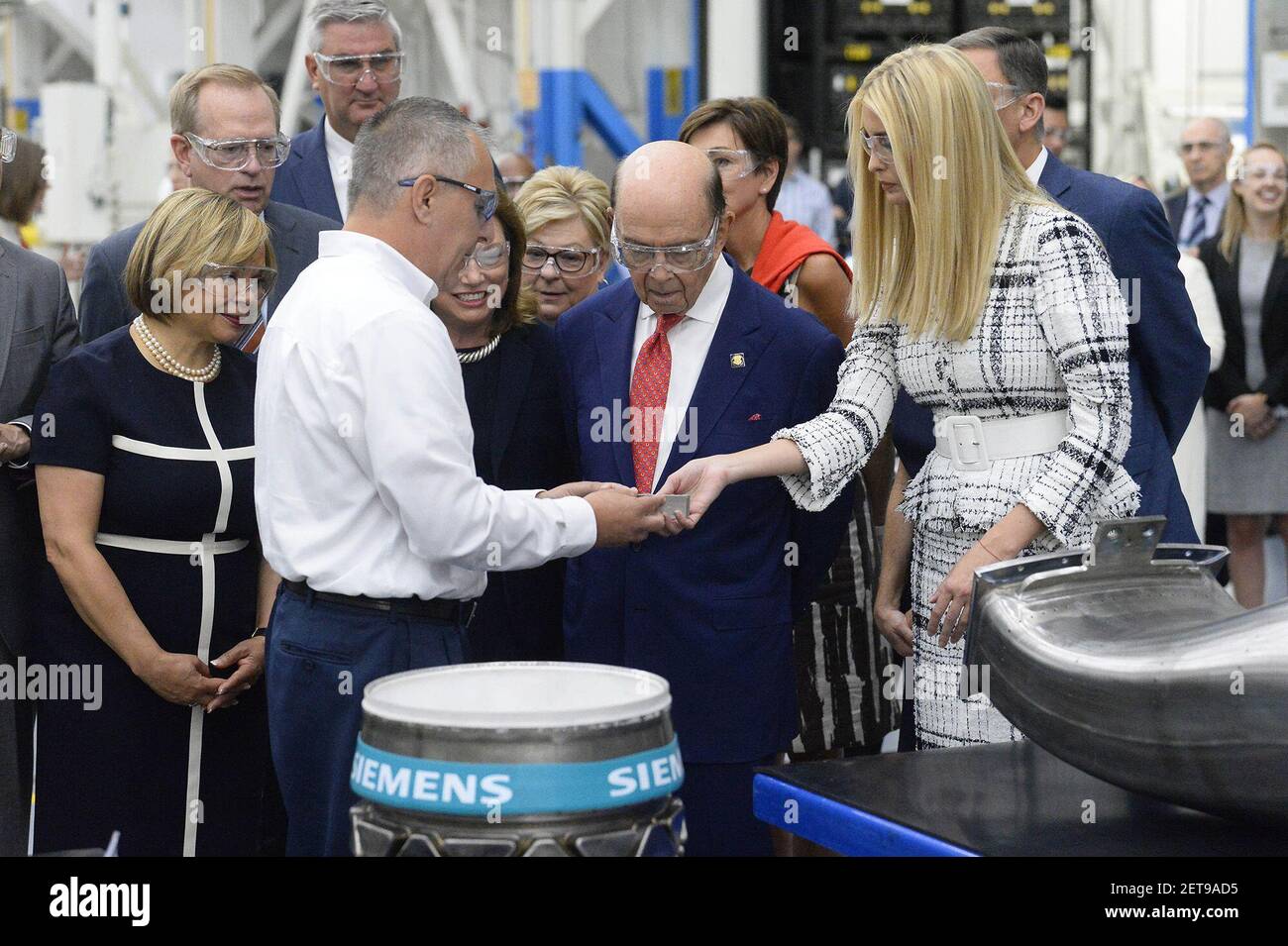 U.S. Secretary of Commerce Wilbur Ross, center, and Ivanka Trump ...