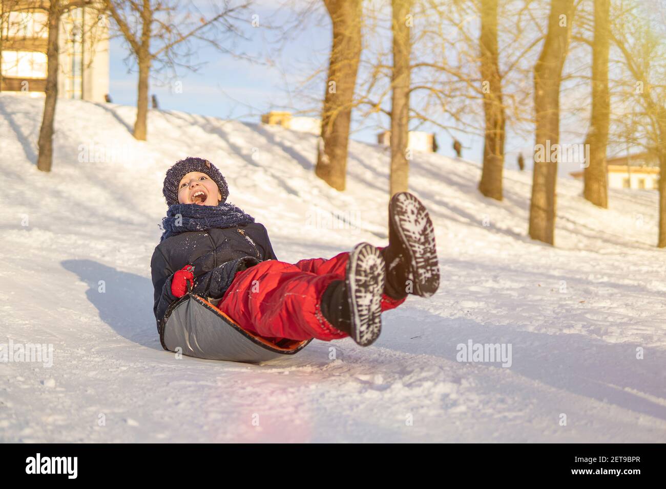 Kids play on ice slide hi-res stock photography and images - Alamy