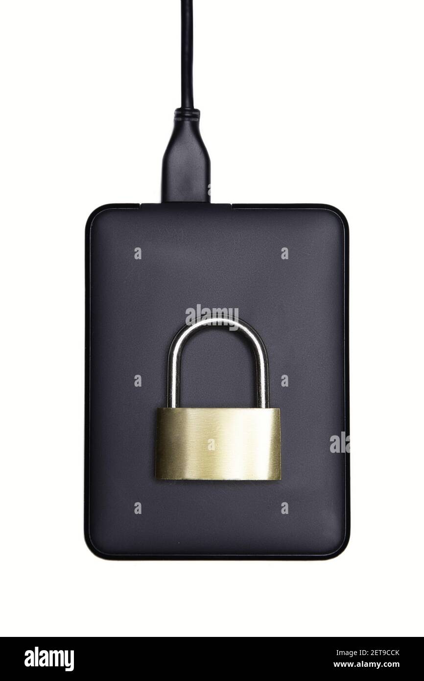 A black hard drive with a padlock isolated on a white background Stock ...