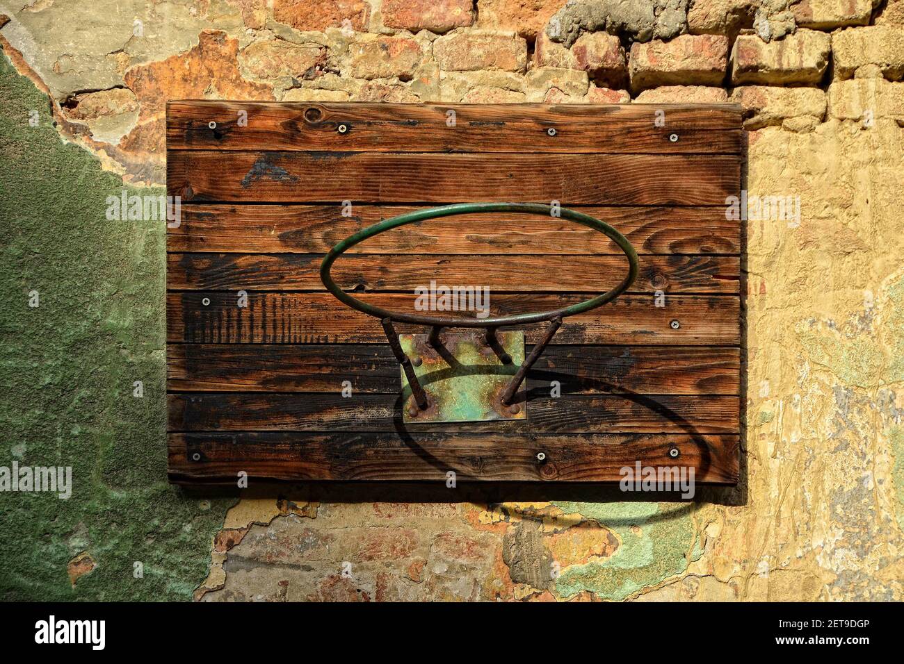 A basket hoop without a net on an old wall Stock Photo - Alamy