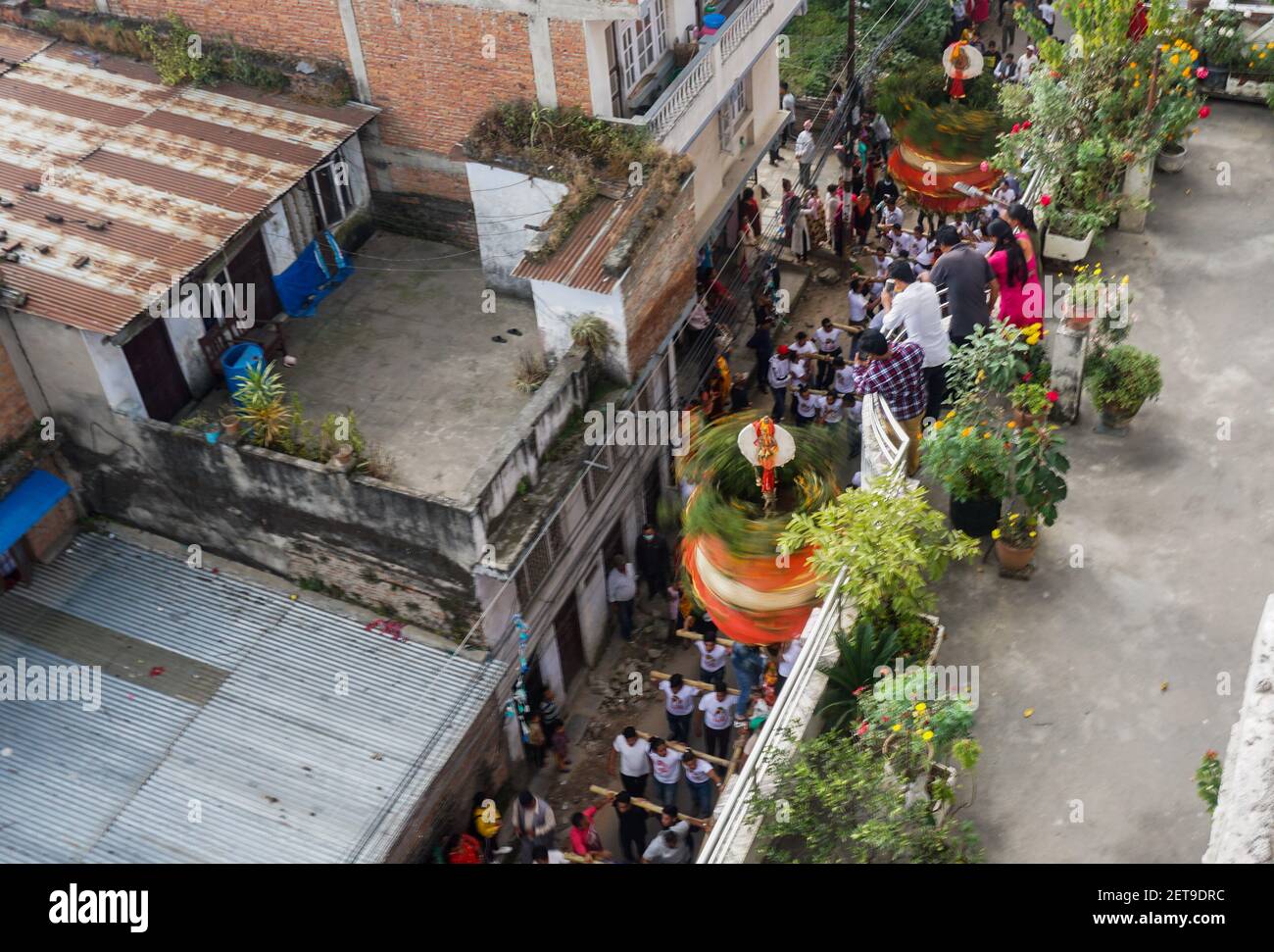 Devotees rotate the top part of a chariot of Lord Satya Narayan during ...