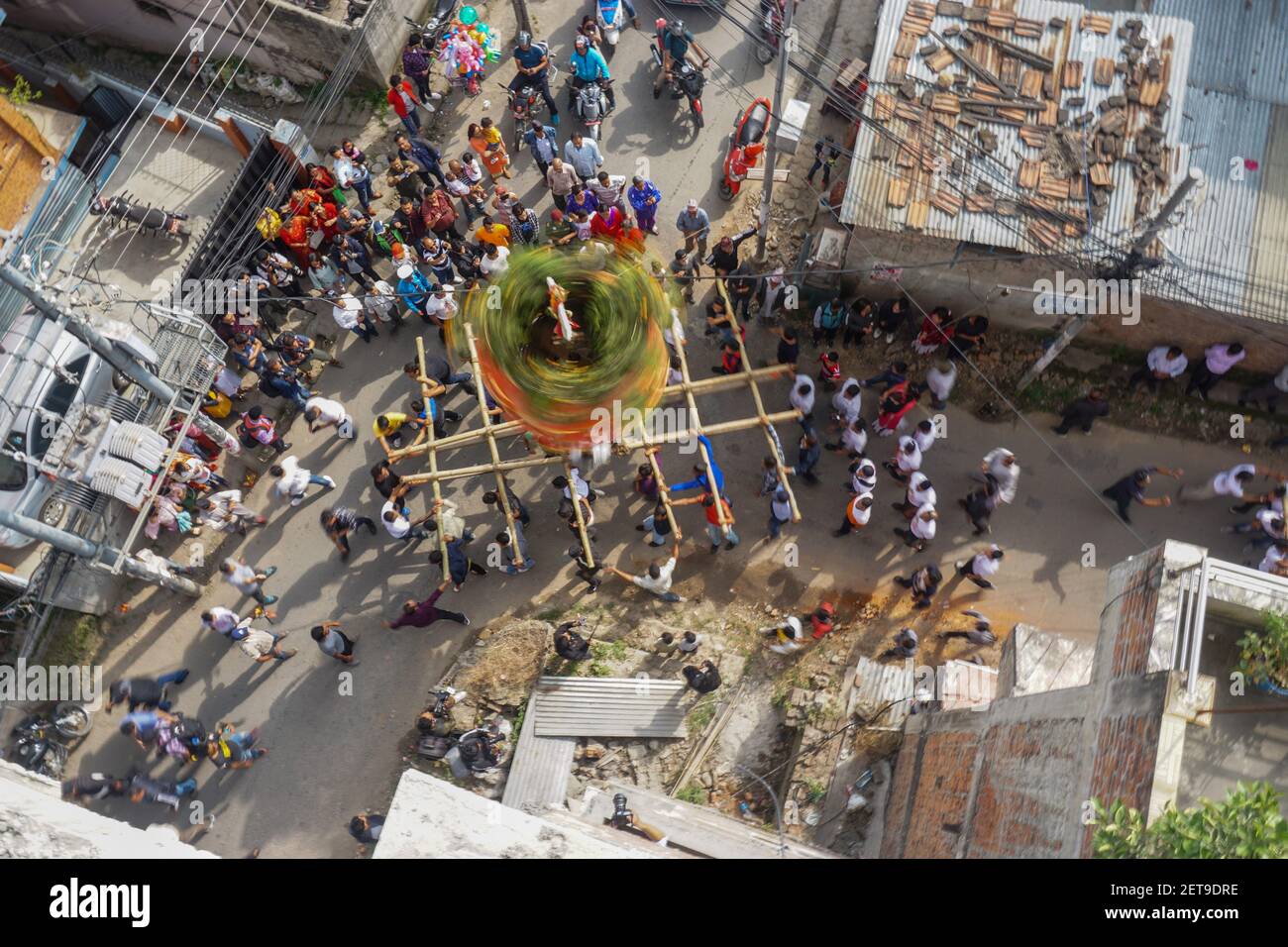 Devotees rotate the top part of a chariot of Lord Satya Narayan during ...