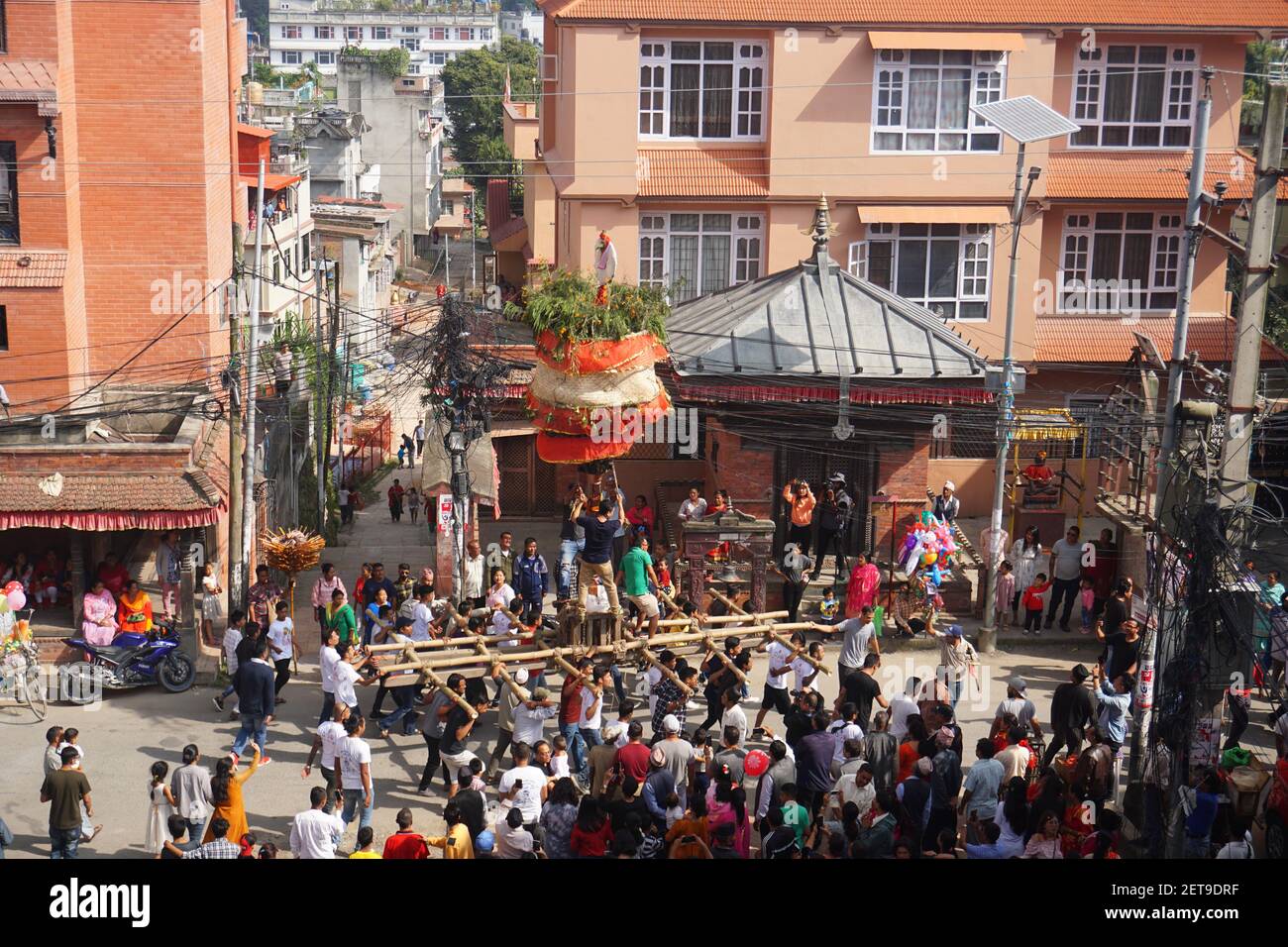 Nepalese devotees carry the chariot of Lord Satya Narayan during the ...
