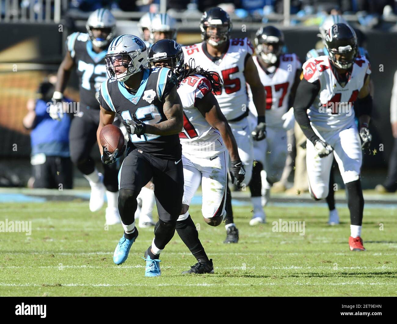 Carolina Panthers wide receiver D.J. Moore (12) gains yards against the ...