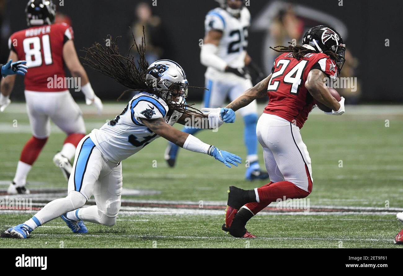 Atlanta Falcons running back Devonta Freeman (24) breaks past Carolina ...