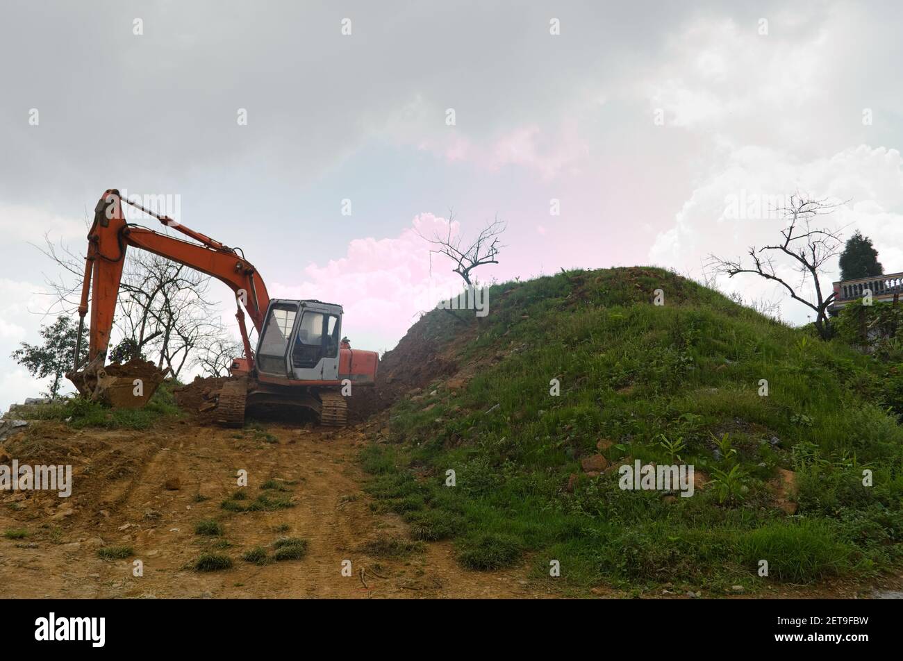Excavator digging land. Construction site with heavy machinery ...
