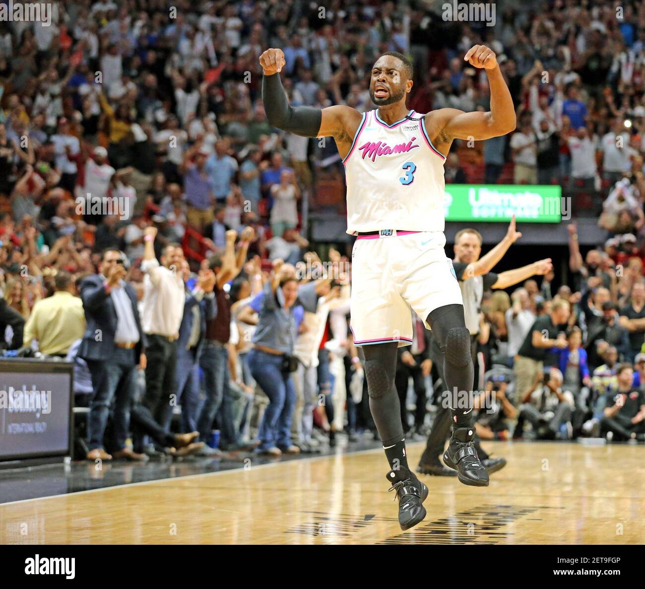 The Miami Heat's Dwyane Wade celebrates with the crowd after scoring ...