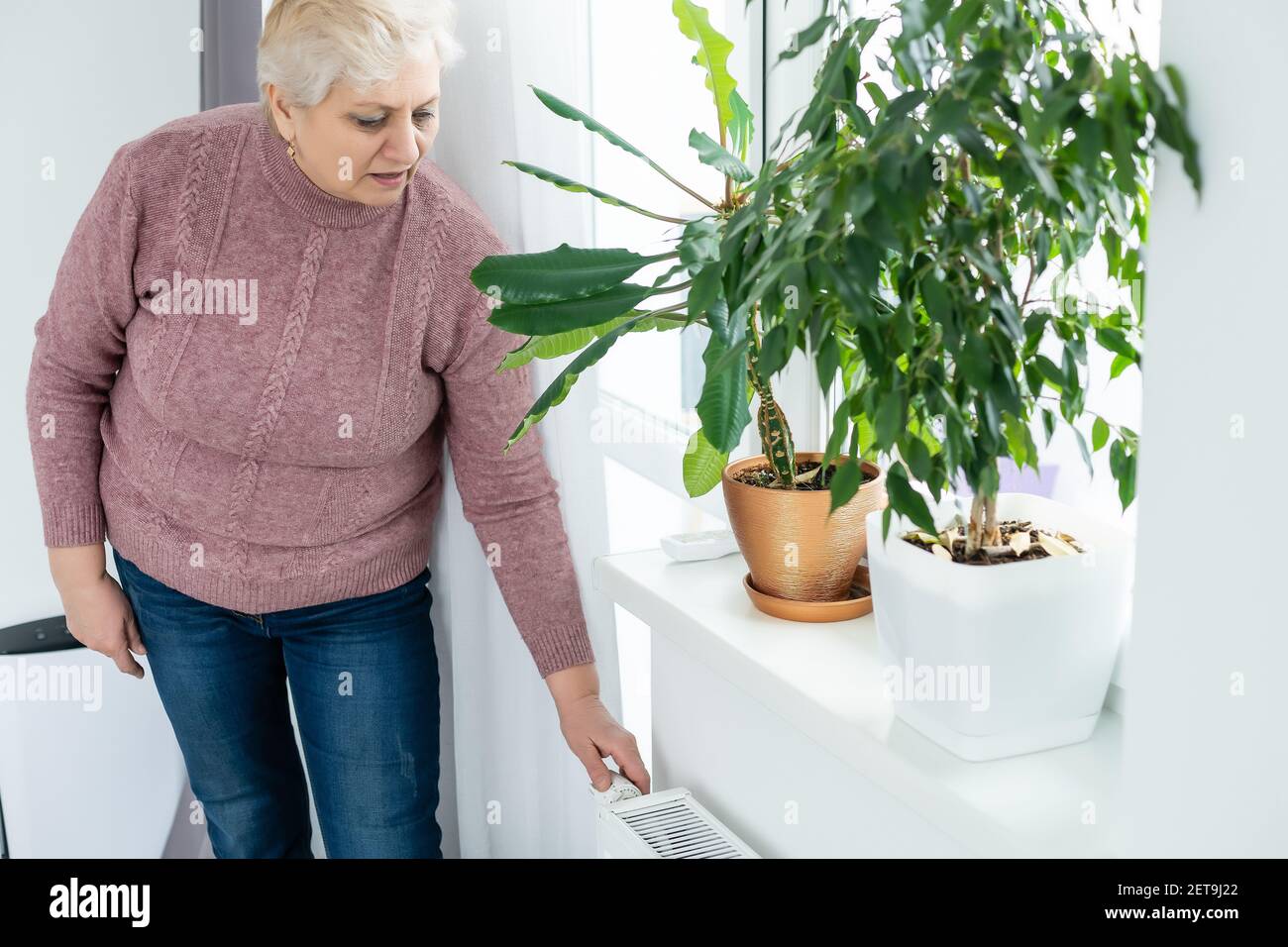 Woman heater elderly hi-res stock photography and images - Alamy
