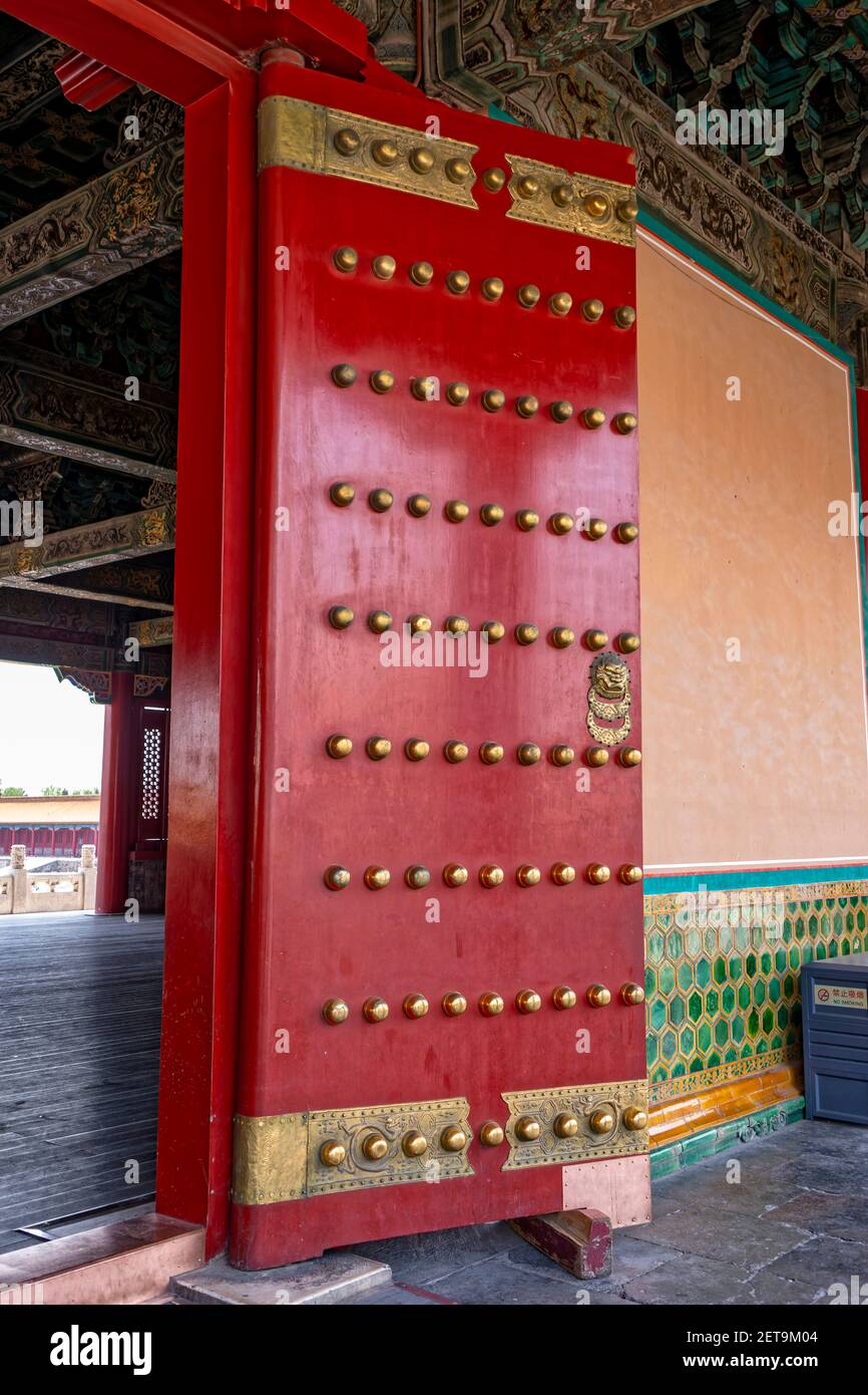 Beijing, China. 2nd June, 2017. Golden nails on giant wooden red door ...