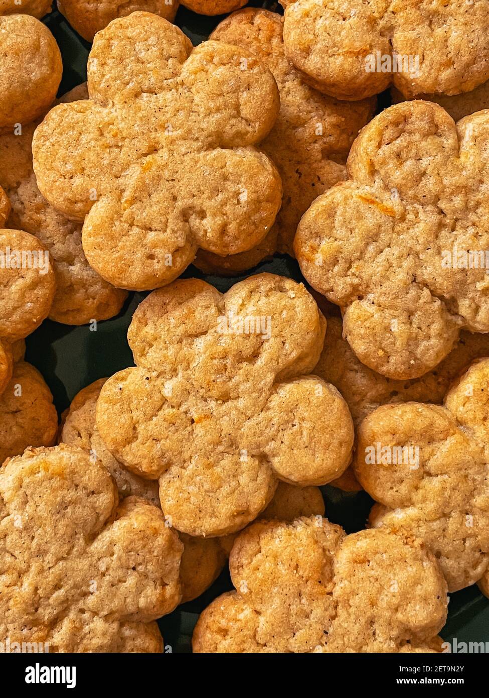A vertical shot of flower-shaped cookies Stock Photo - Alamy