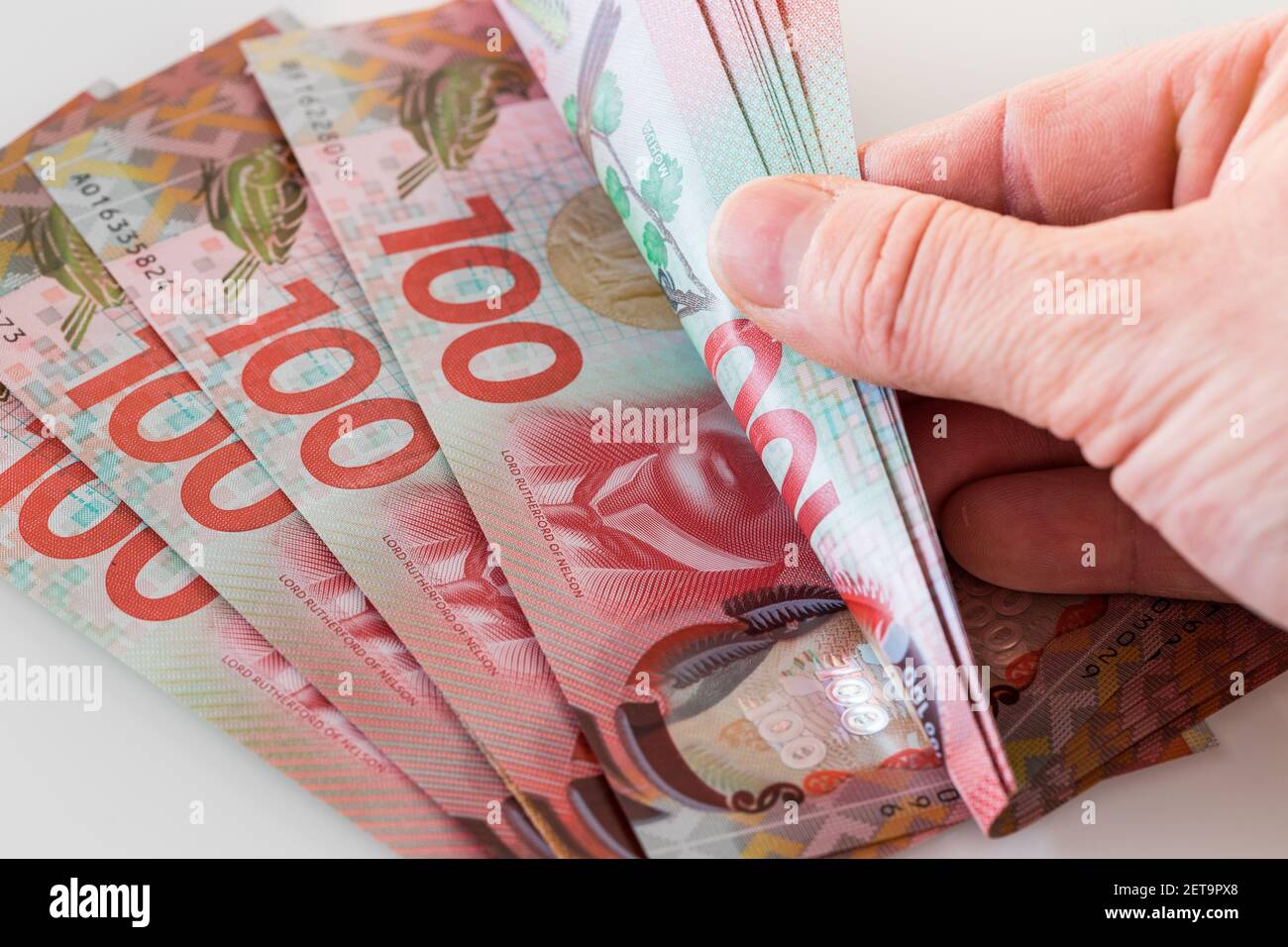 Converted 100 dollar bills from New Zealand Stock Photo - Alamy