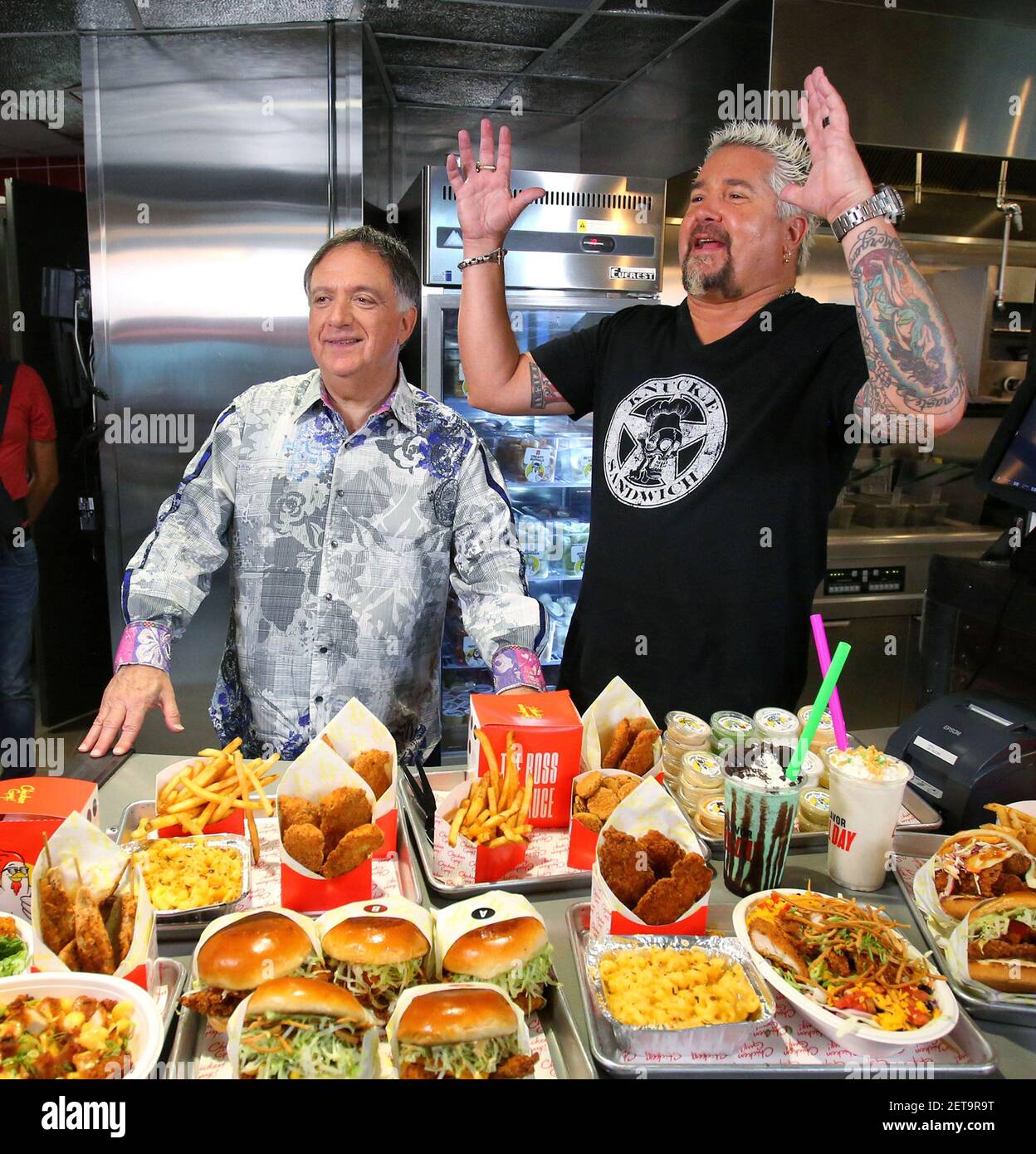 Celebrity chef Guy Fieri, right, talks with legendary restaurateur and ...