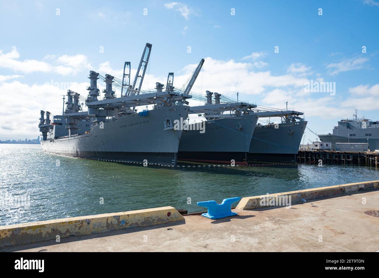 Three ships are moored together on a pier in the Ferry Point ...