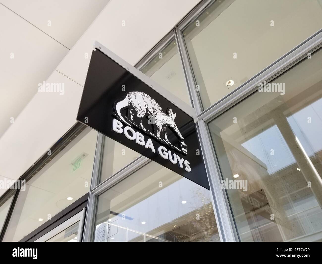 Low-angle photograph of sign on newly opened Boba Guys restaurant, a ...