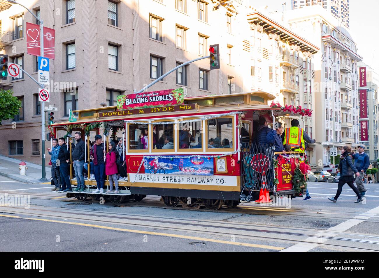 Close-up of San Francisco cable car passing through an intersection on ...