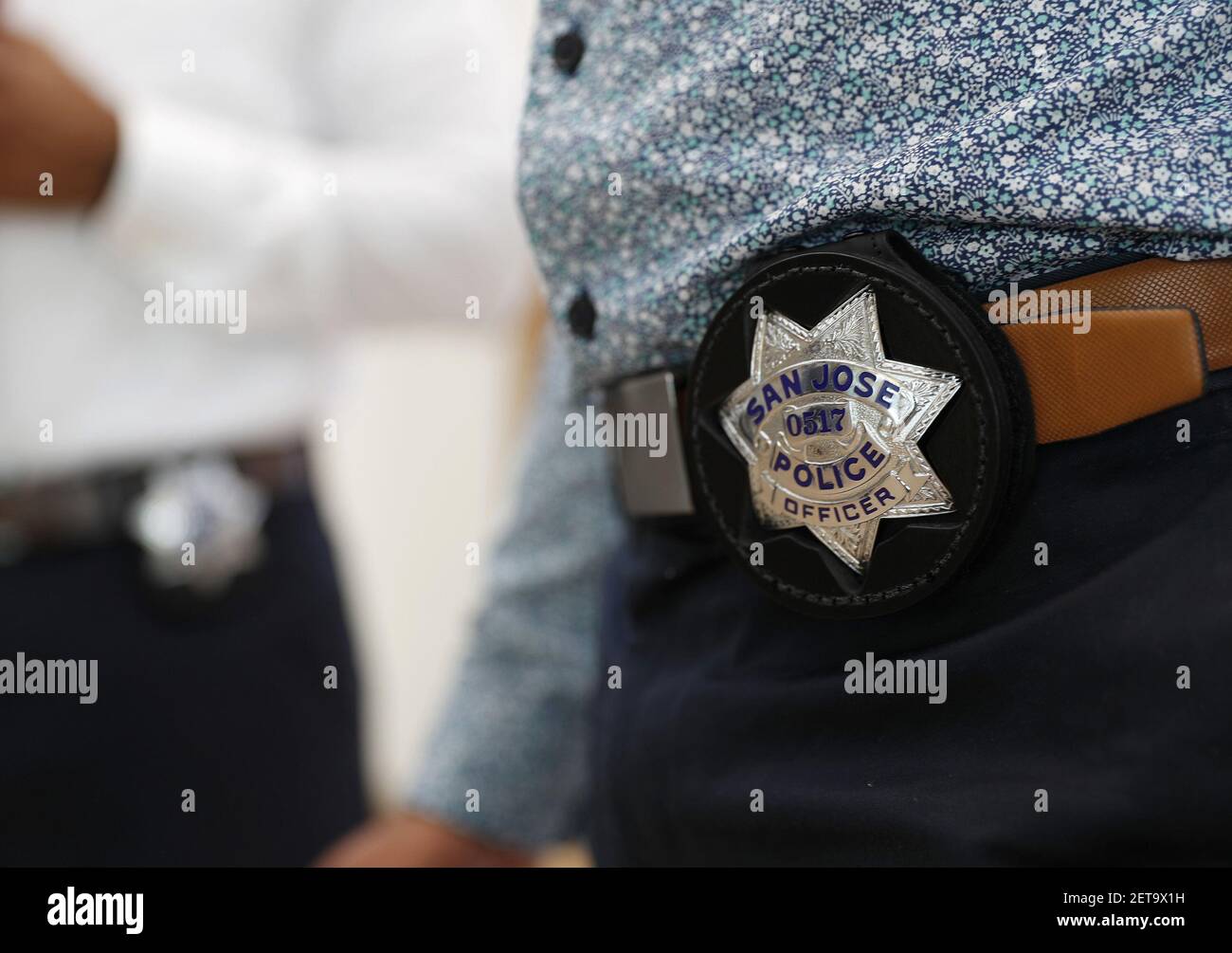 A police badge worn by a graduate at the San Jose Police Department ...