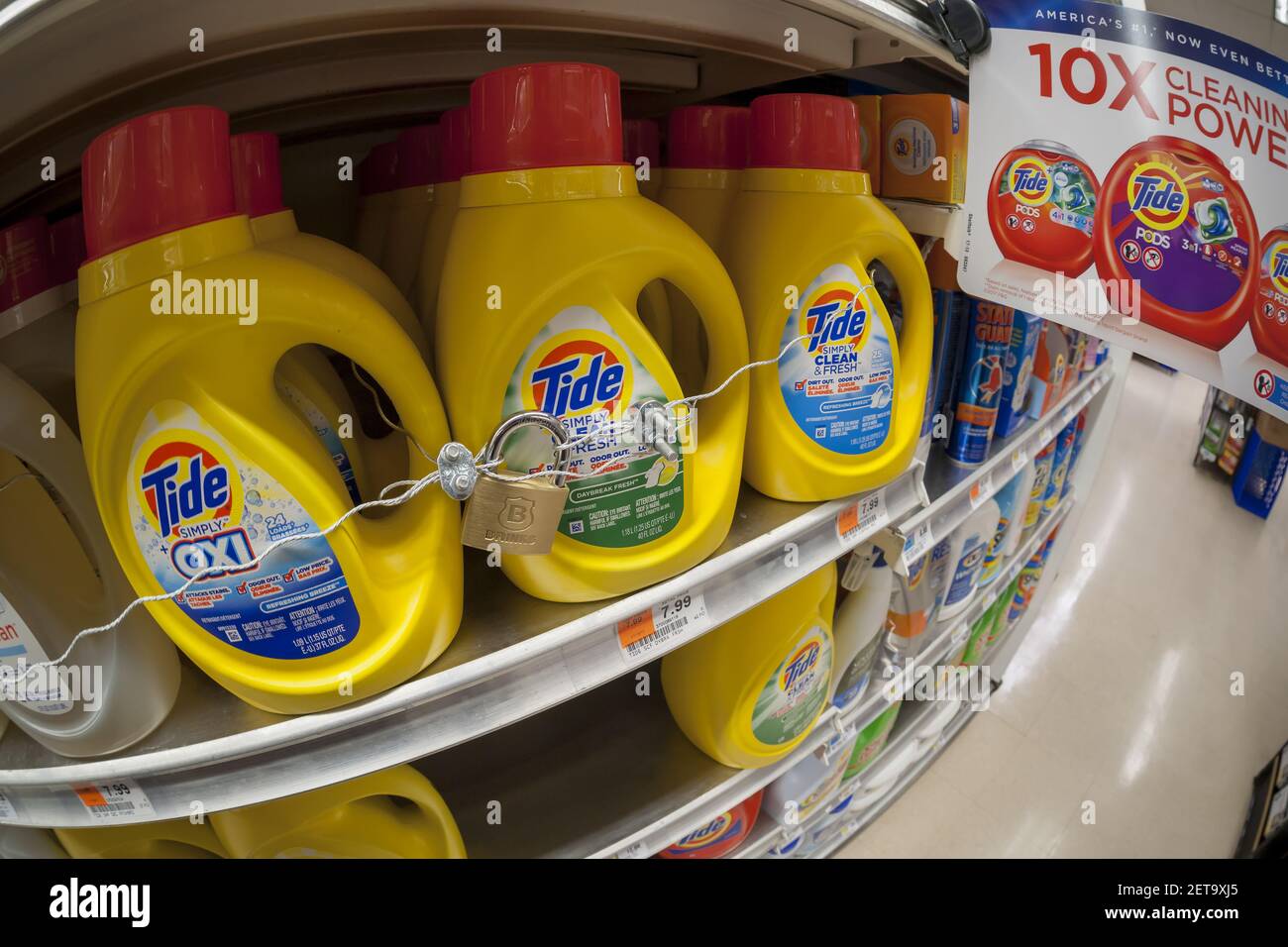Packages of Procter & Gamble's Tide detergent are chained up to deter shoplifters in a ...