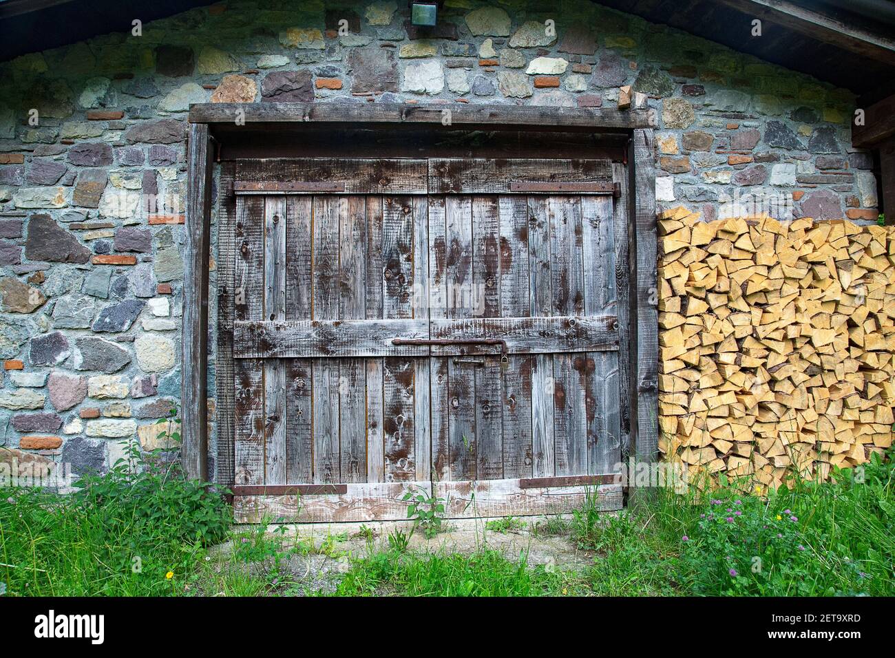 Beautiful stone hut in the high mountains Stock Photo - Alamy