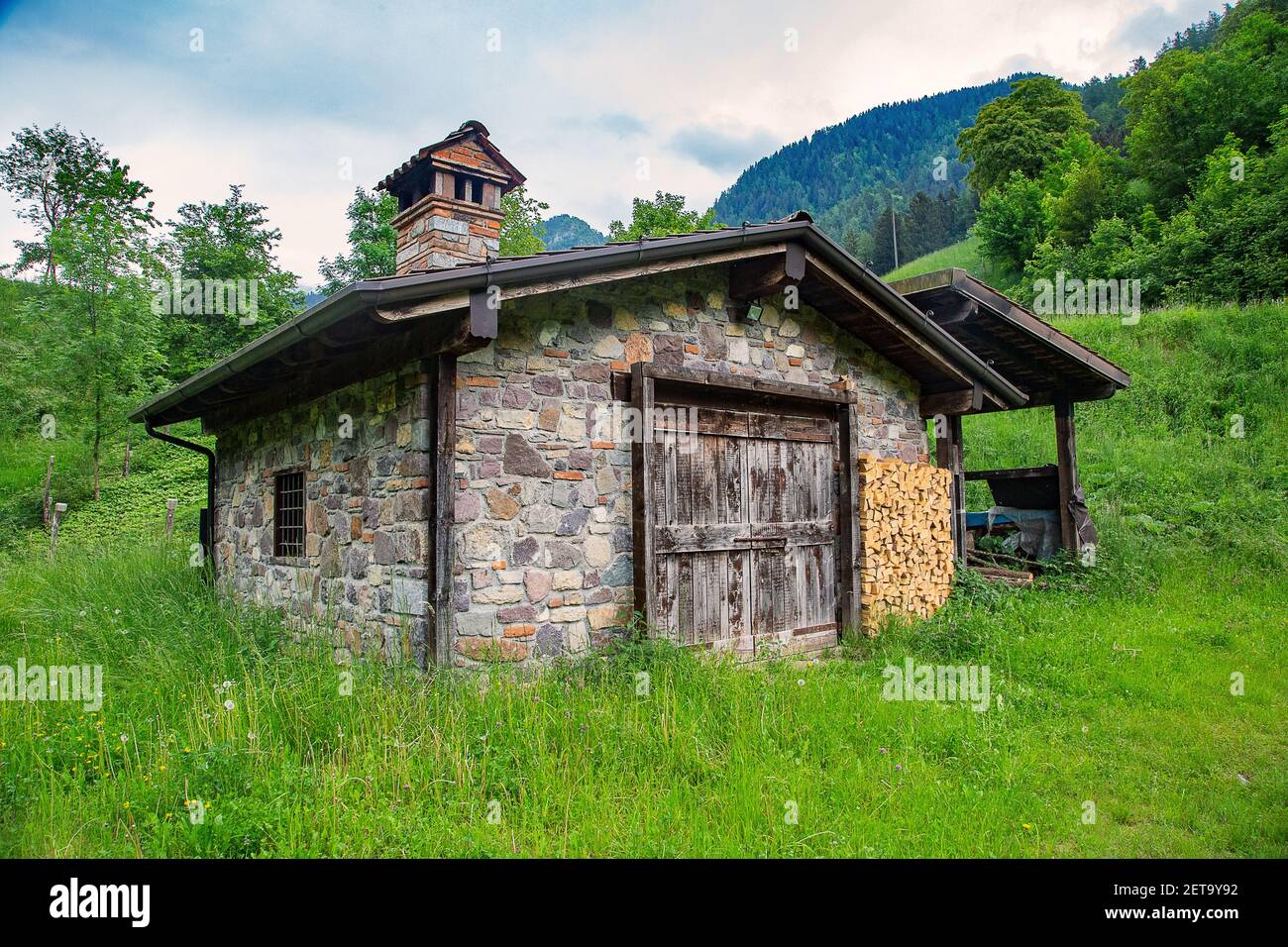 Beautiful stone hut in the high mountains Stock Photo - Alamy