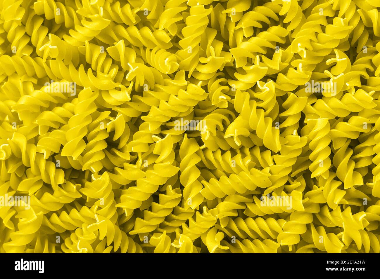 Pasta of Iluminating yellow color background - the fashionable color of ...