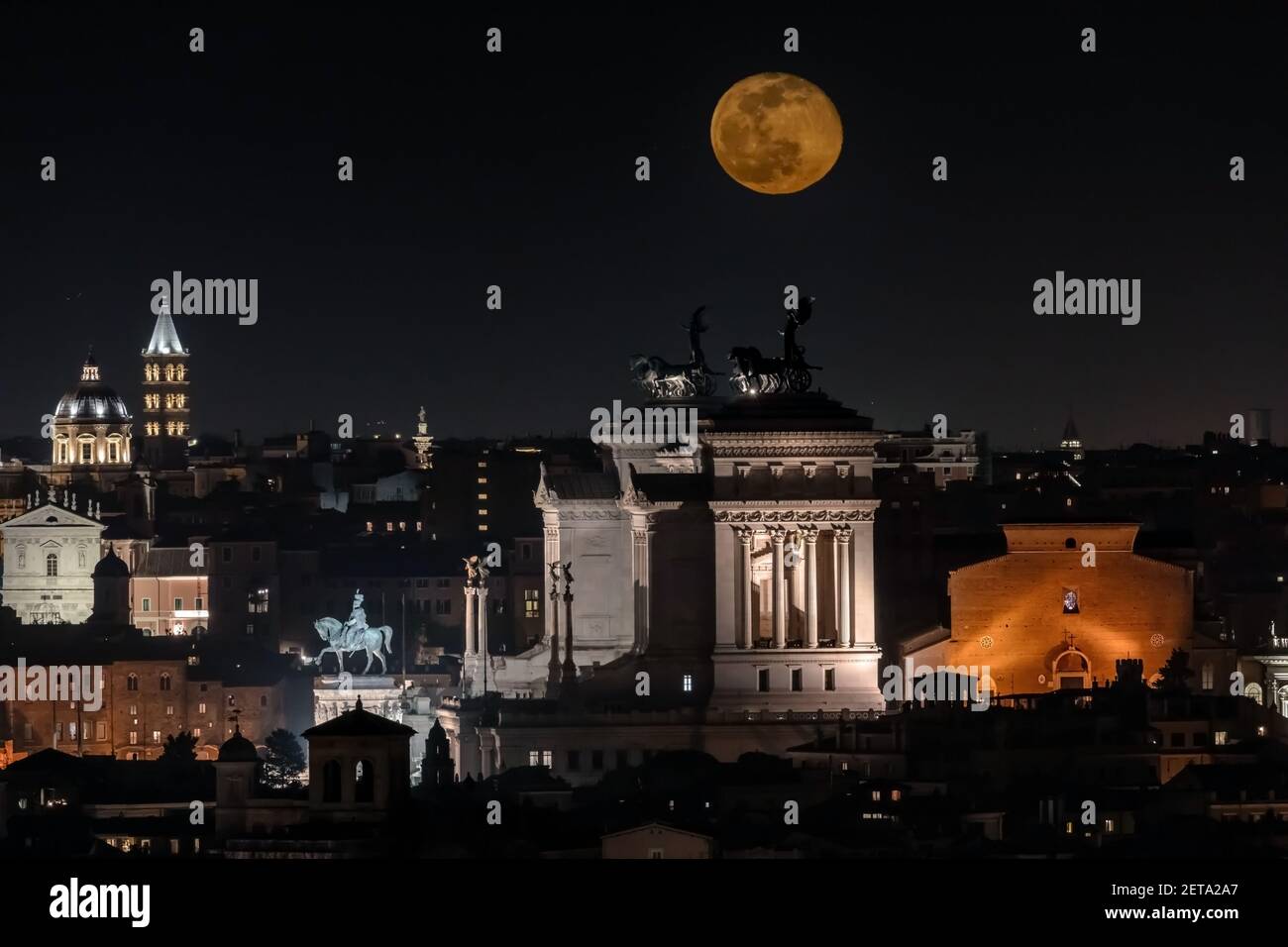 Rome city skyline at night with full moon Stock Photo - Alamy