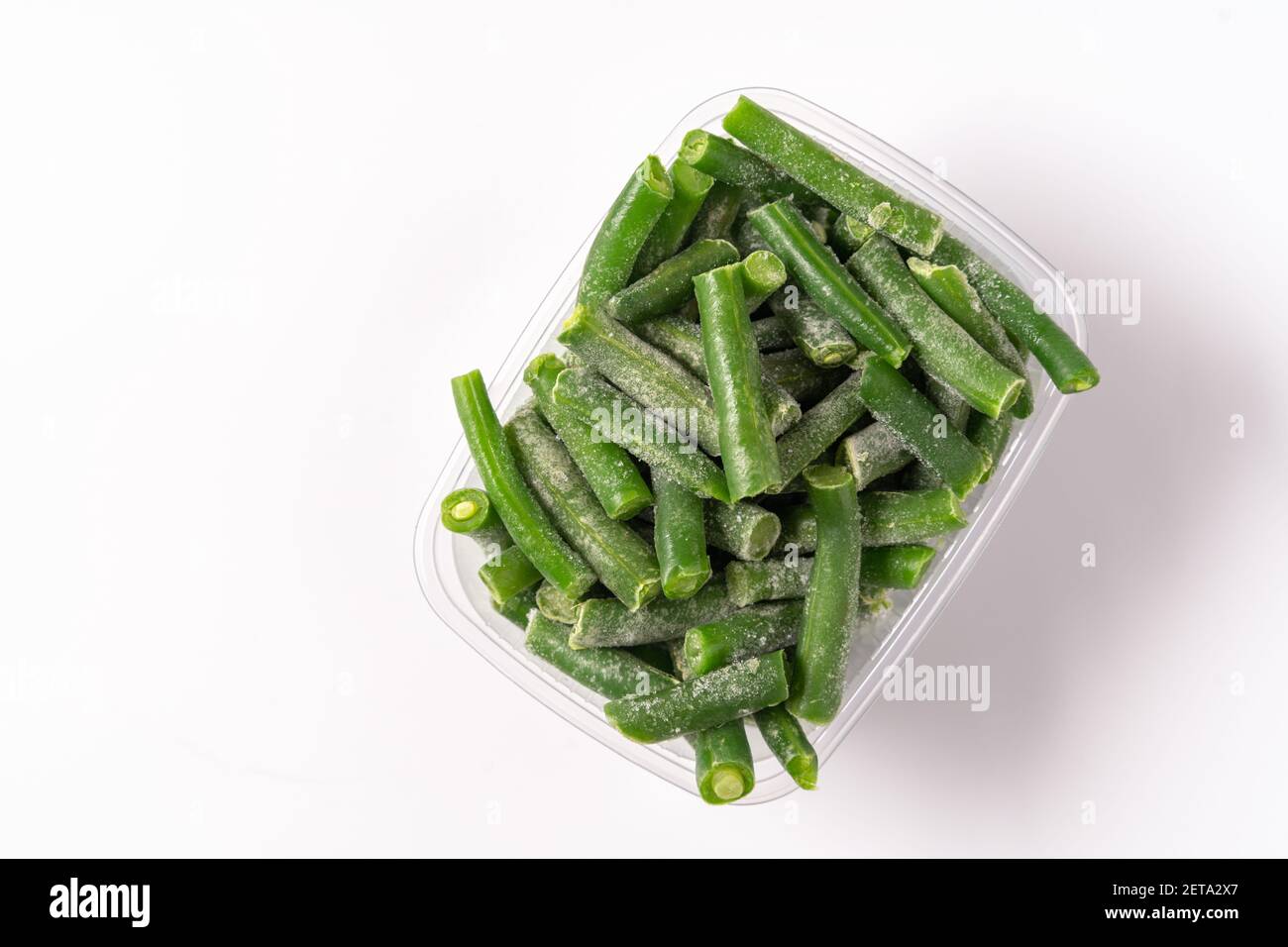 Frozen green beans in plastic box isolated on white background,flat lay ...