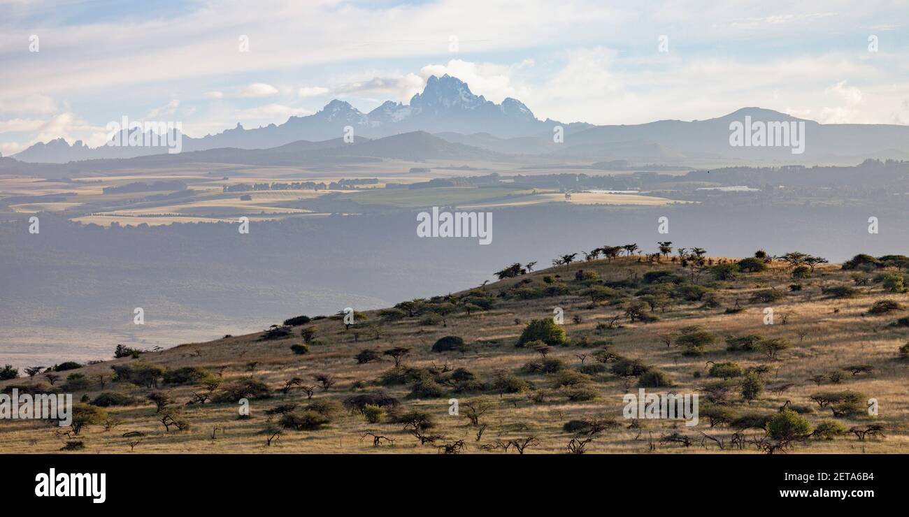 Late evening view with clouds across the plains towards Mount Kenya ...