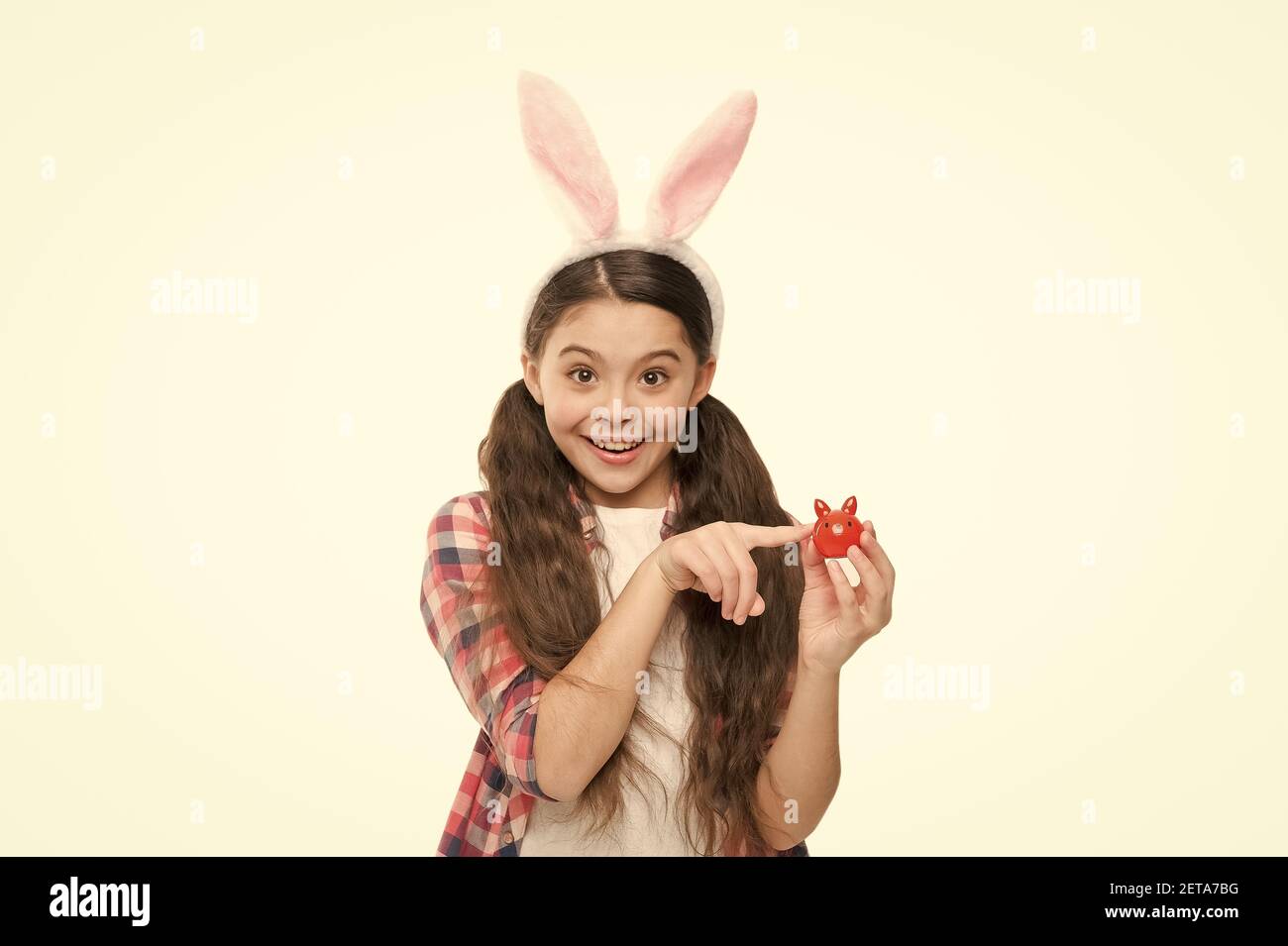 Adorable bunny. Cute little girl wearing bunny ears headband. Looking pretty in easter bunny ...