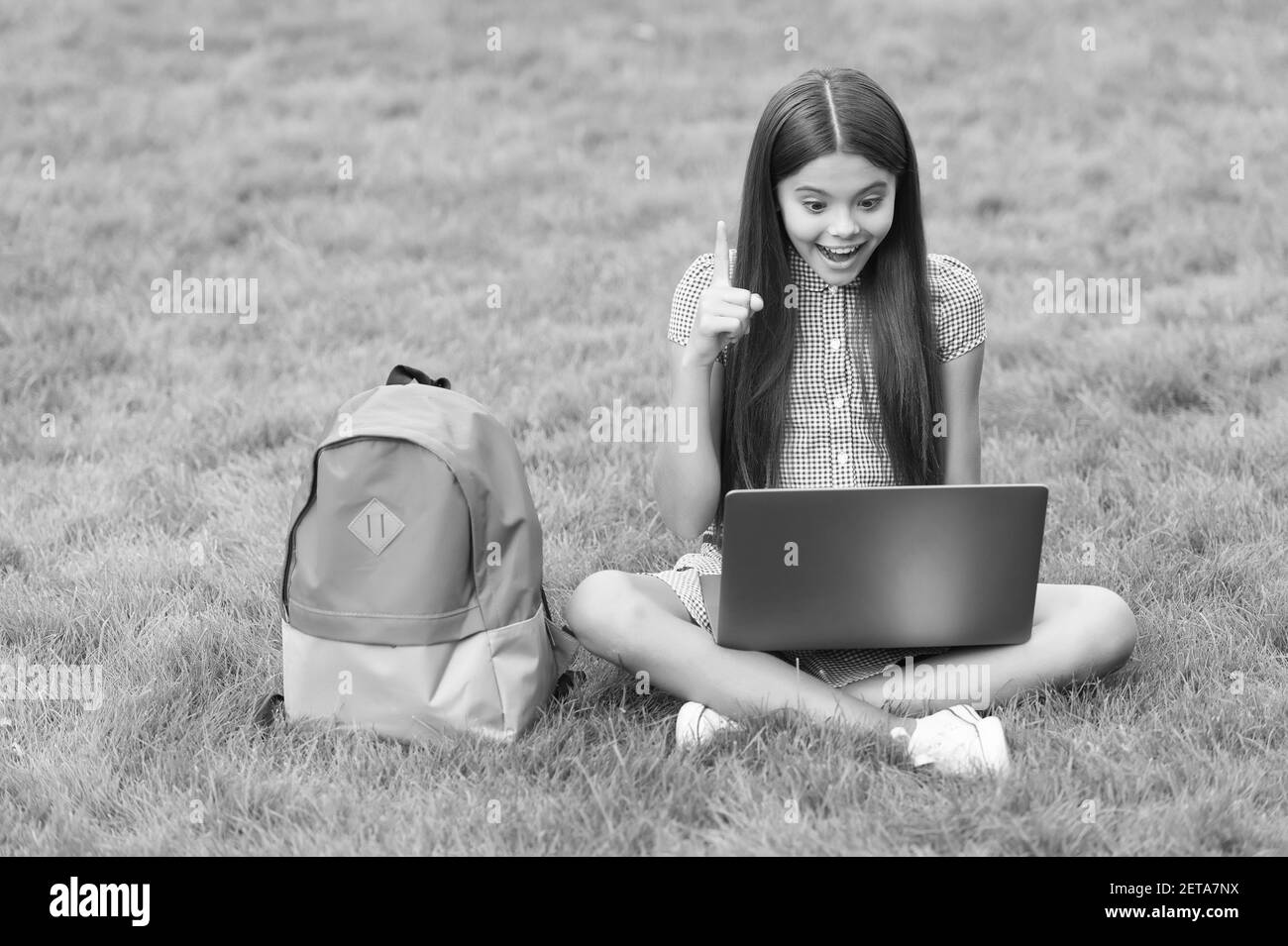 inspired happy child using computer for online school study sitting in ...