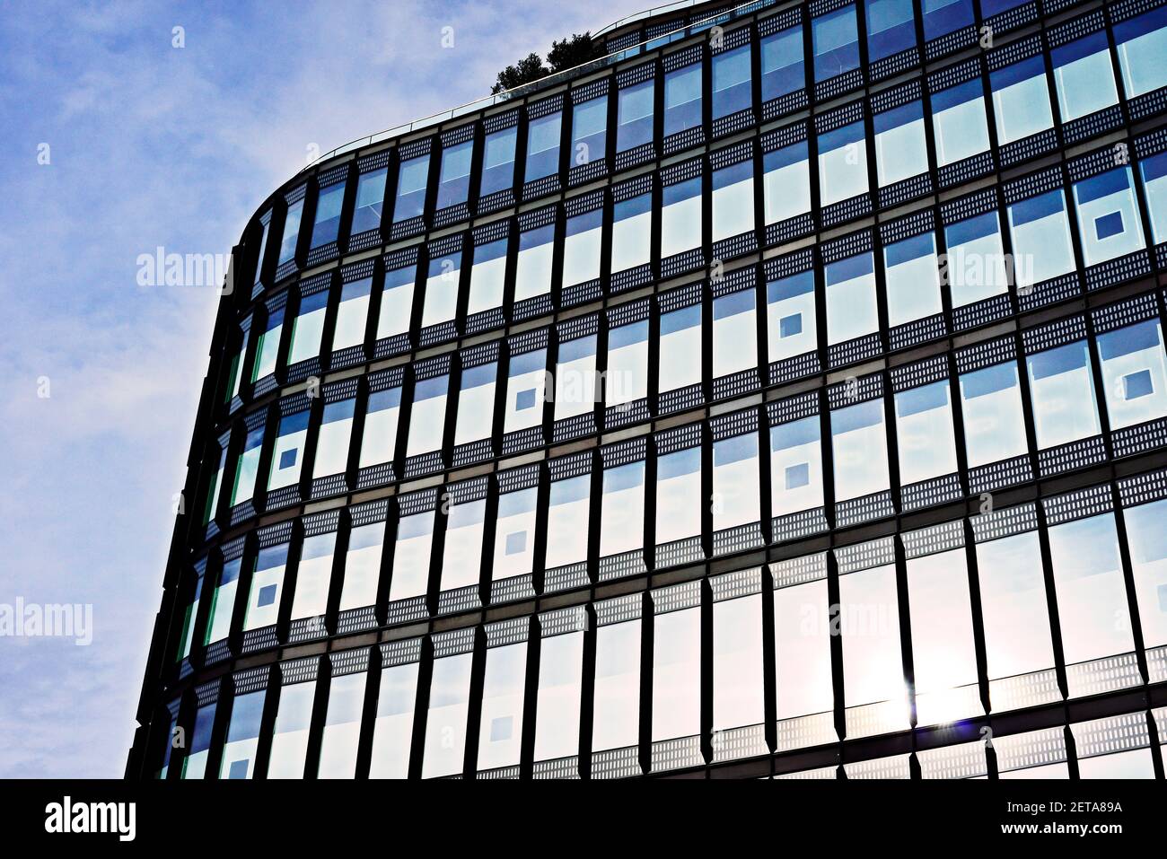 Offices with sun reflecting on windows Stock Photo - Alamy
