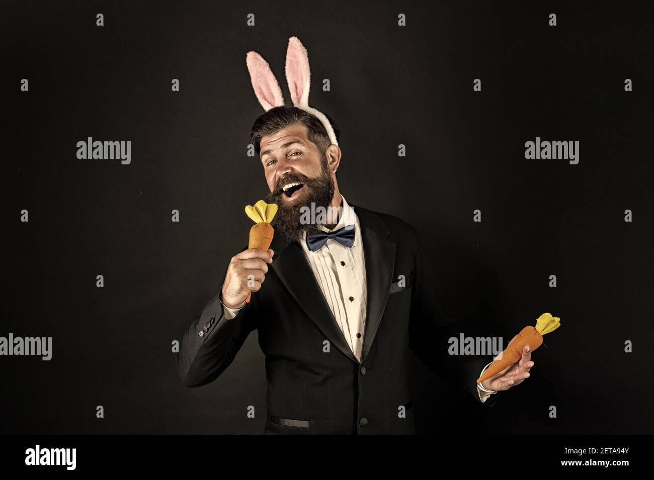 Feel the song. Easter singer. Businessman pretend singing with carrot ...
