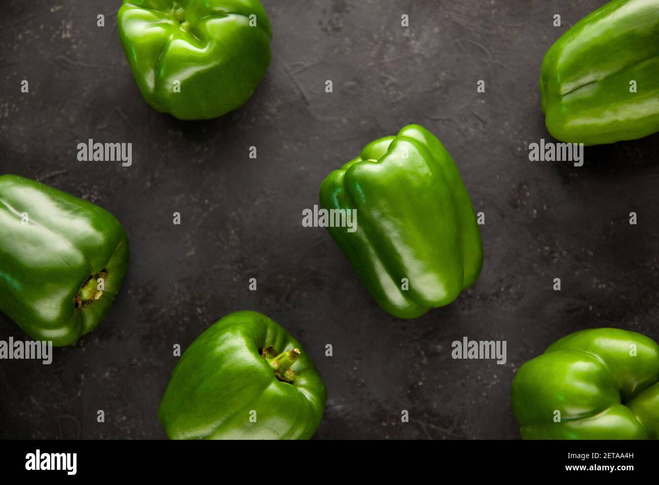 Green peppers pattern on dark grey background Stock Photo - Alamy
