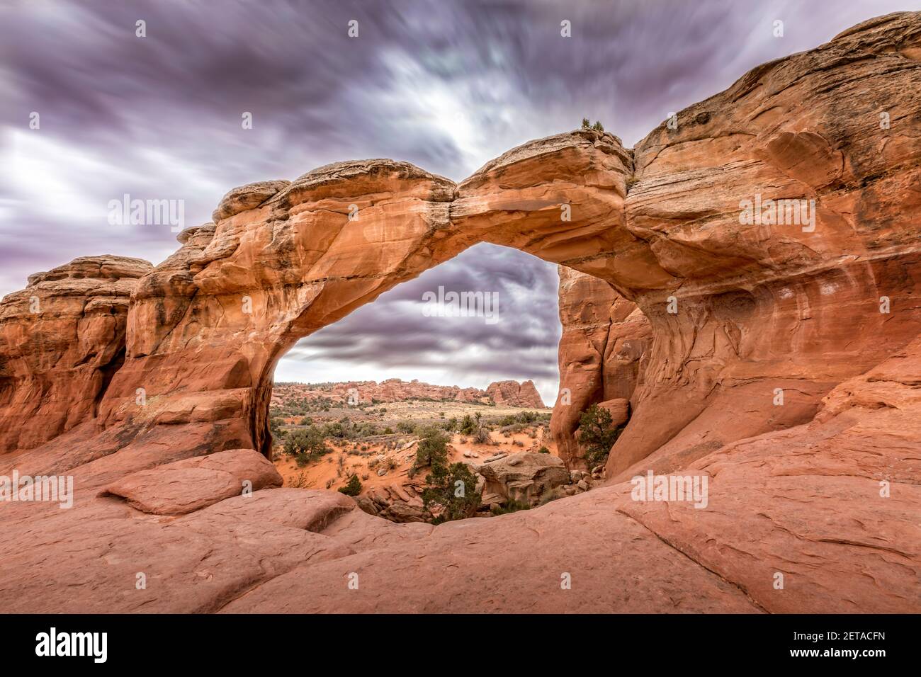 The famous Broken Arch in the Arches National Park, Utah and dramatic ...