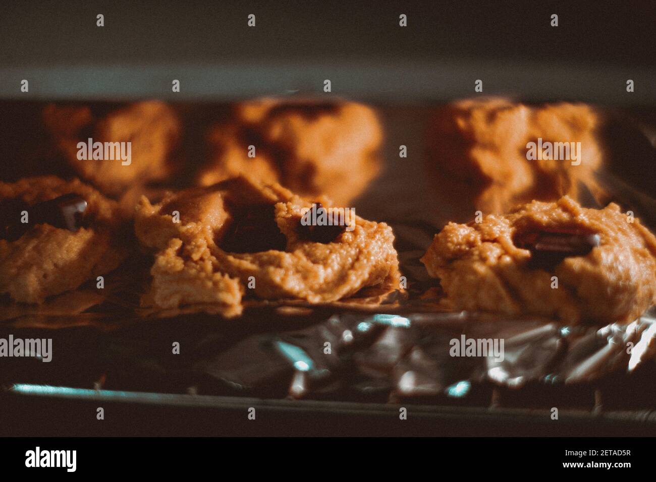 Raw unbaked shortbread pastries with a chocolate chunk on the top Stock ...
