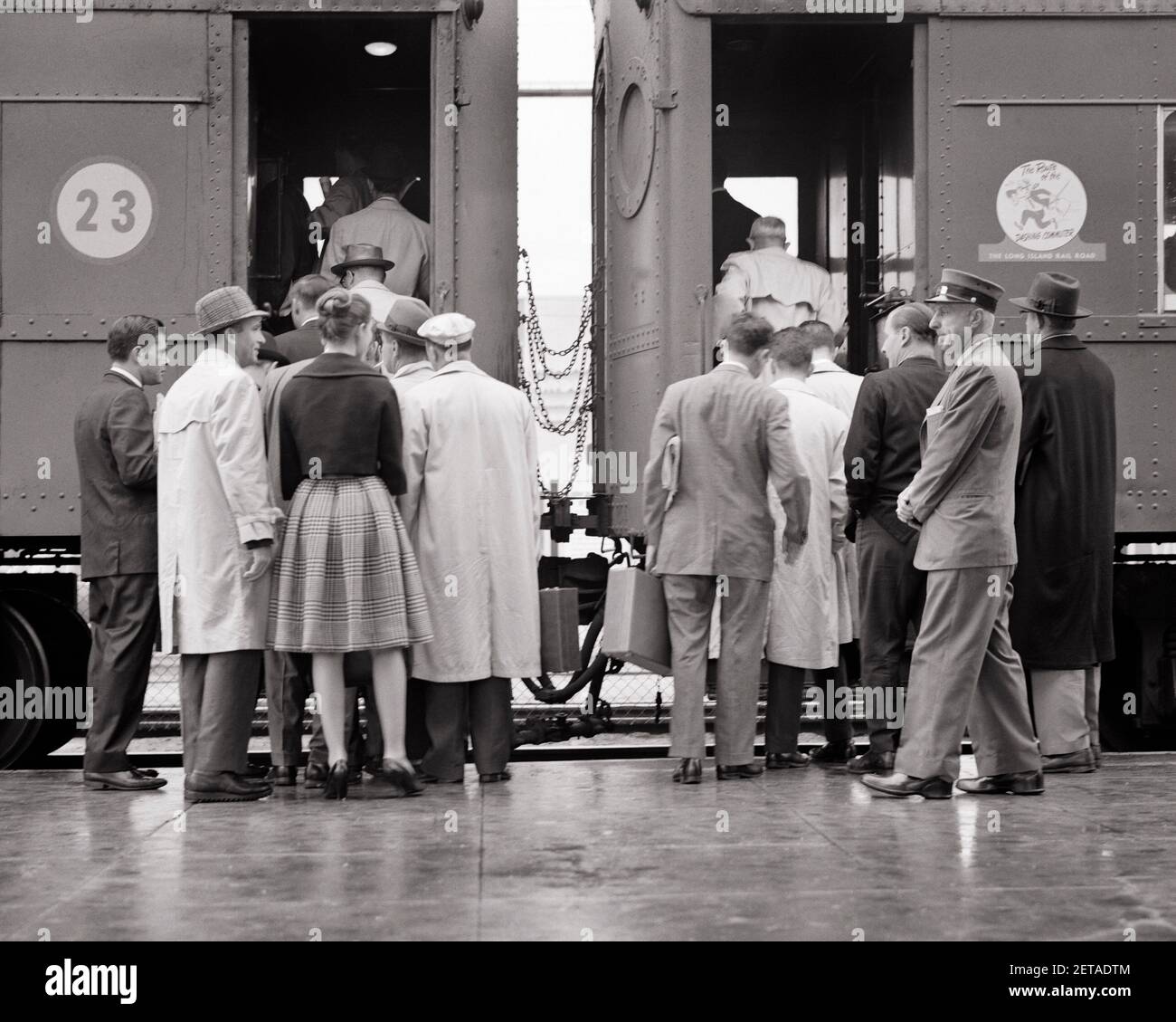 1950s MEN AND WOMEN COMMUTERS GETTING ON BOARDING THE MORNING RAILROAD ...