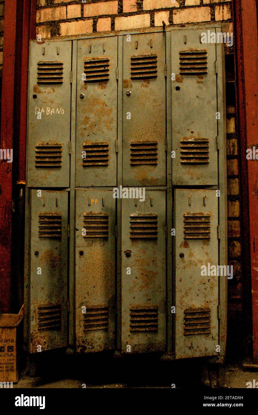 A vertical shot of old rusty lockers in an abandoned building Stock ...
