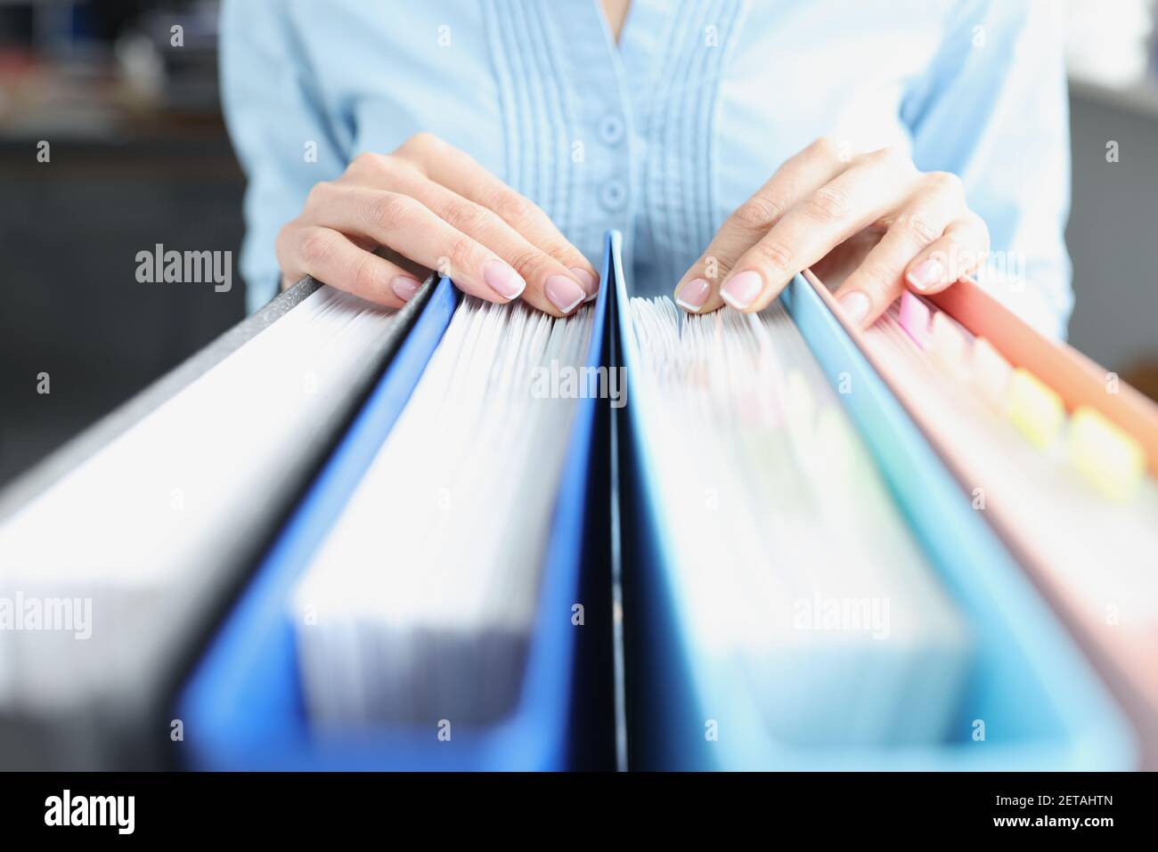 Women's hands on folders with documents closeup Stock Photo - Alamy