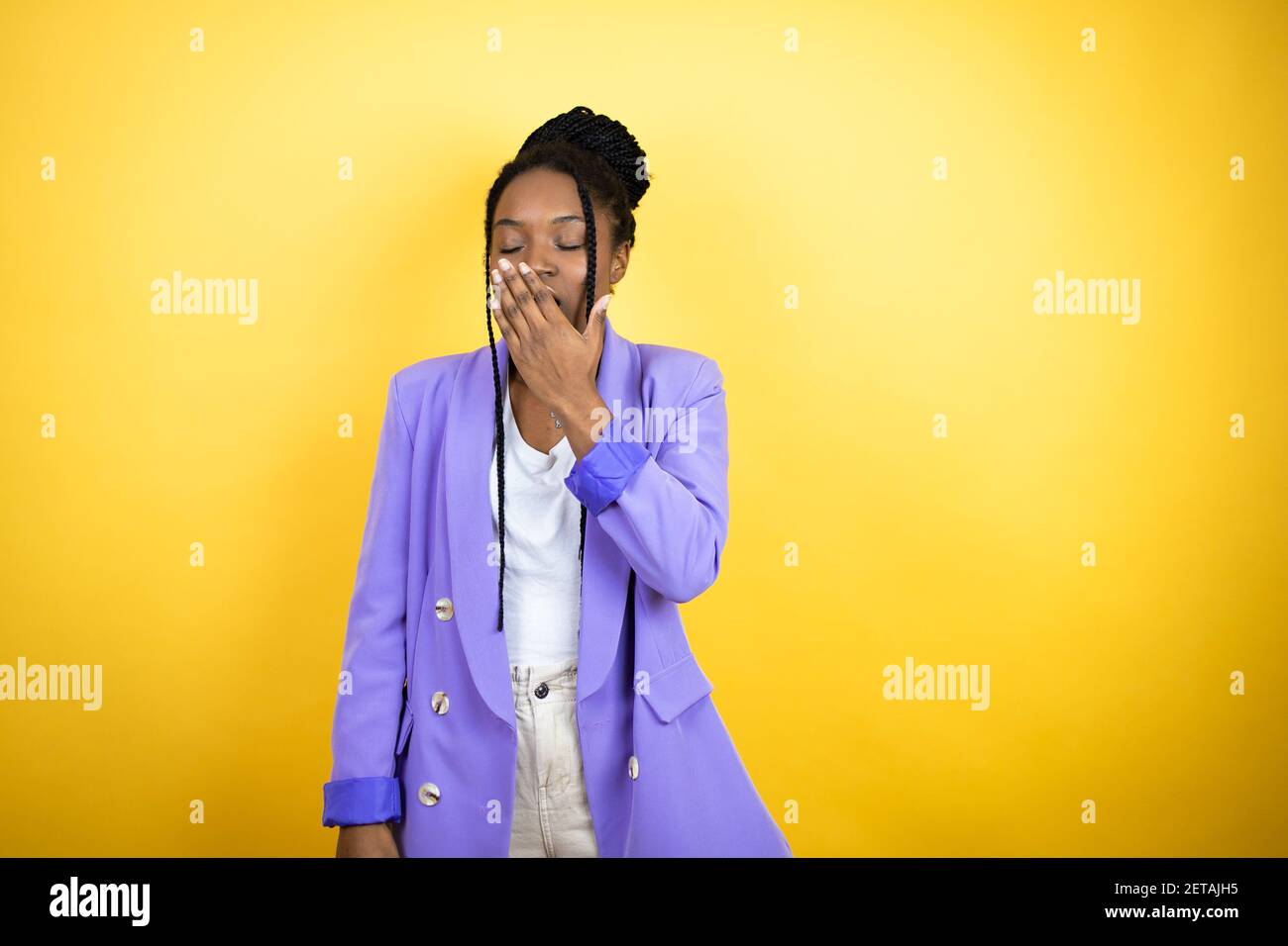 Young african american business woman bored yawning tired covering ...