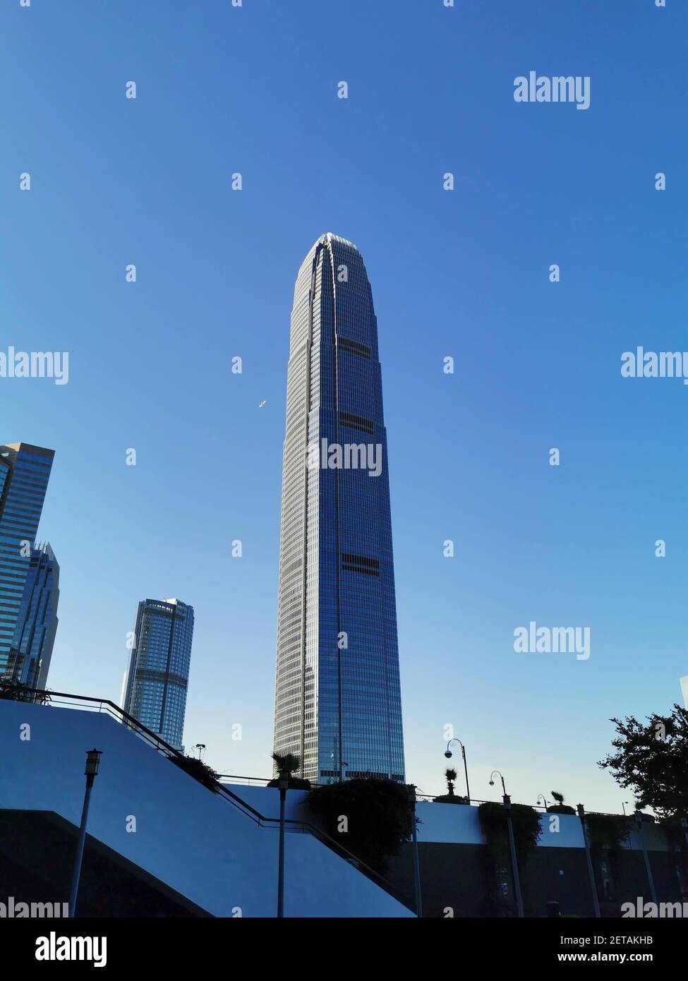 a vertical low angle shot of a high rise building on a light blue sky background Stock Photo - Alamy