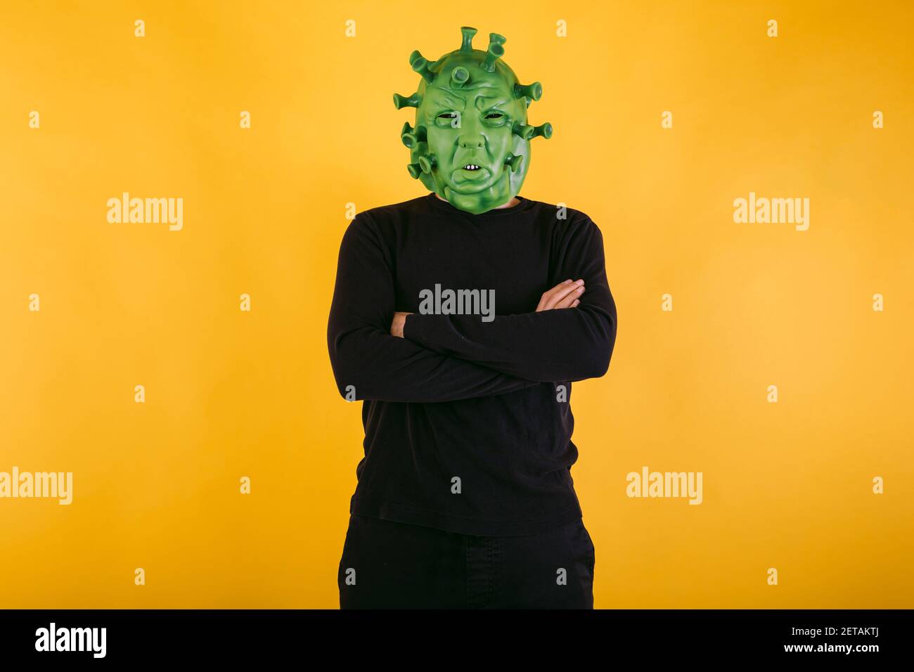 Person disguised as coronavirus with latex mask - covid-19 virus with ...