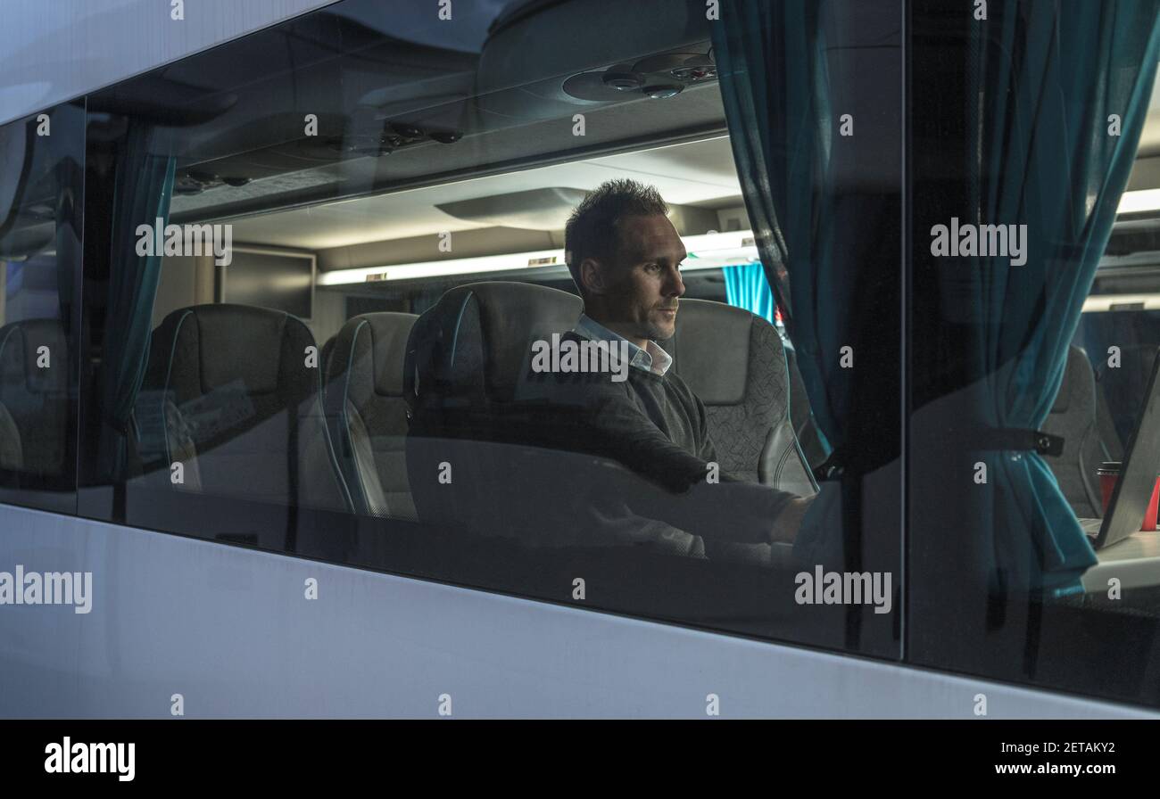 Caucasian Men Seating Inside Modern Bus in Premium Business Seat ...