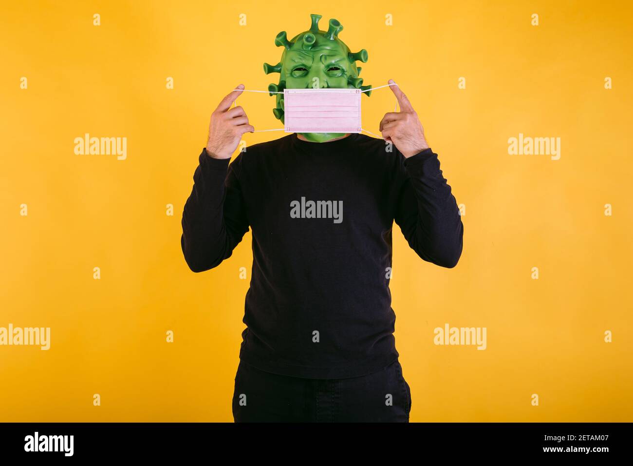 Person disguised as coronavirus with latex mask - covid-19 virus ...