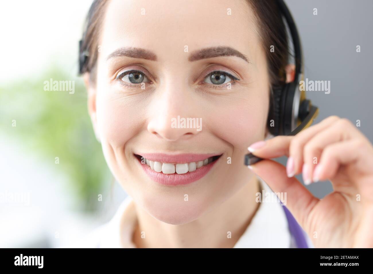 Positive call center operator talking hi-res stock photography and images - Alamy