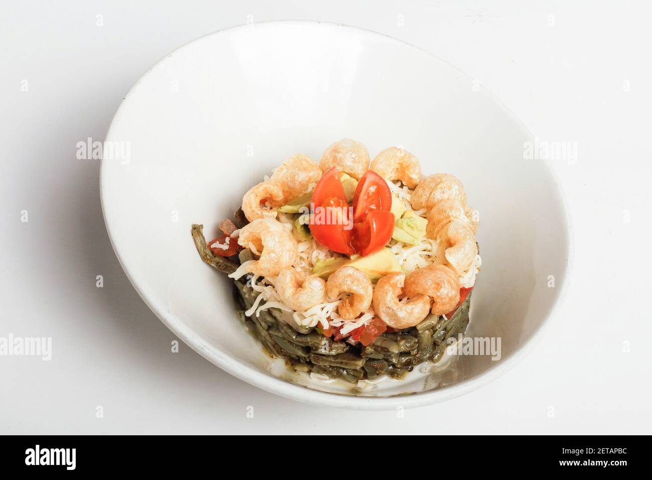 A delicious vegan salad with tomatoes, shrimps, and other ingredients ...