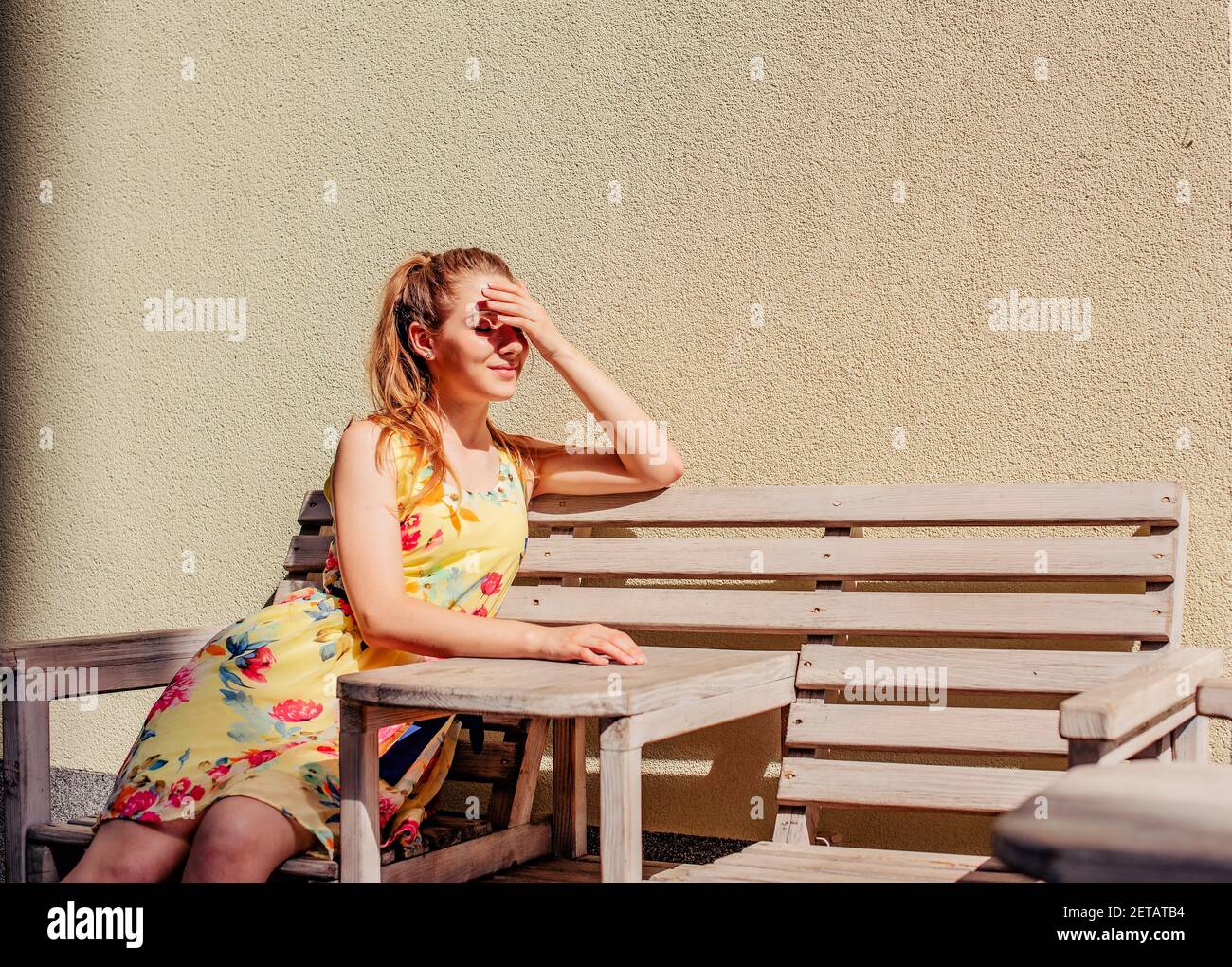girl in dress walks through the old town in the summer. Beautiful ...
