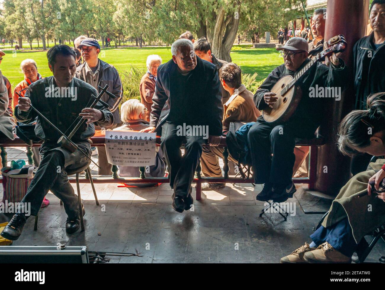 Beijing, China - April 29, 2010: Temple of Heaven. Several men sitting ...
