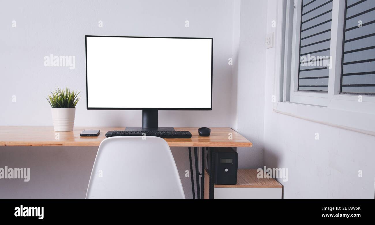 Computer monitor with white blank screen on the business desk with ...
