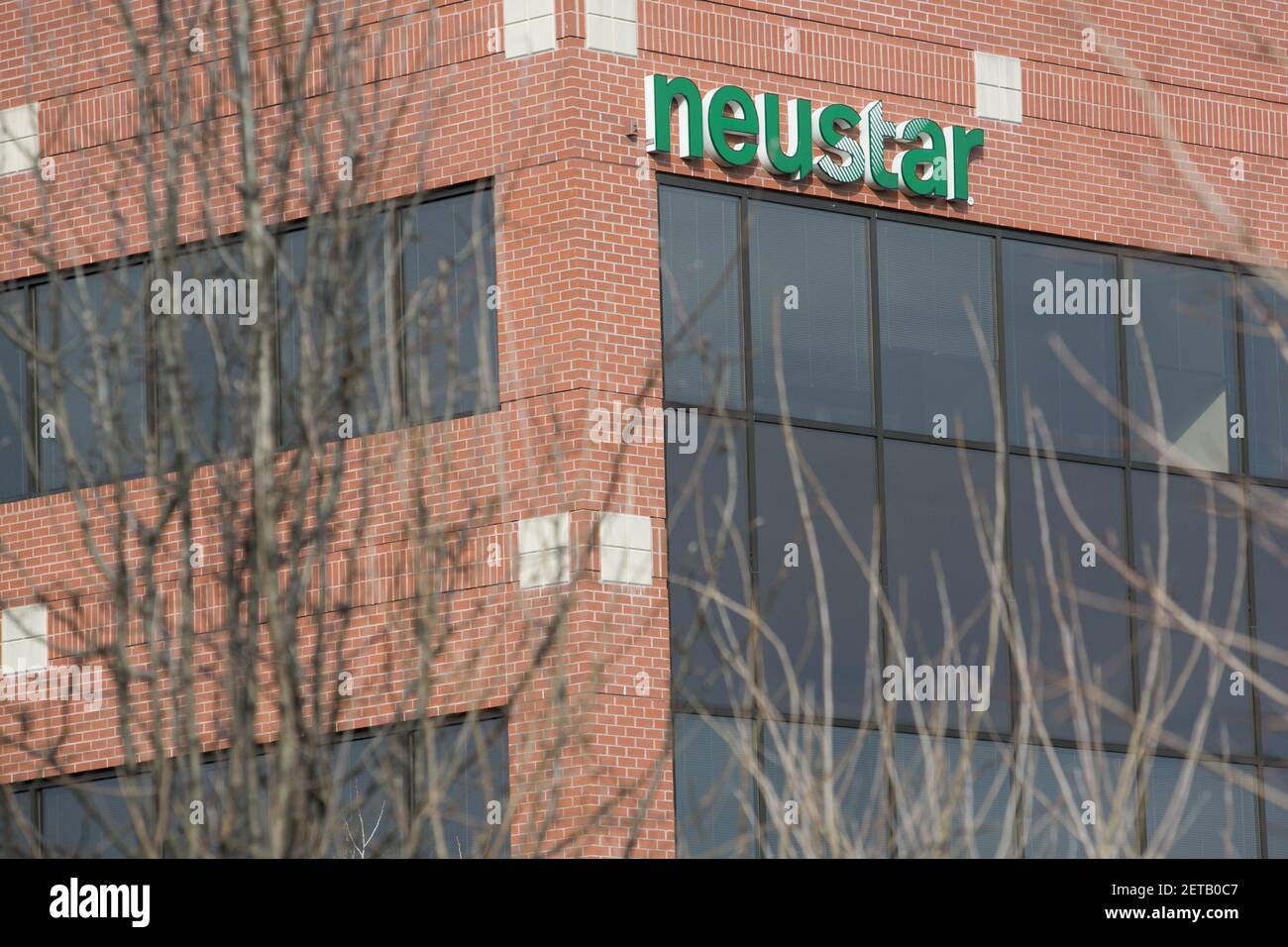 A logo sign outside of the headquarters of Neustar, Inc., in Sterling ...